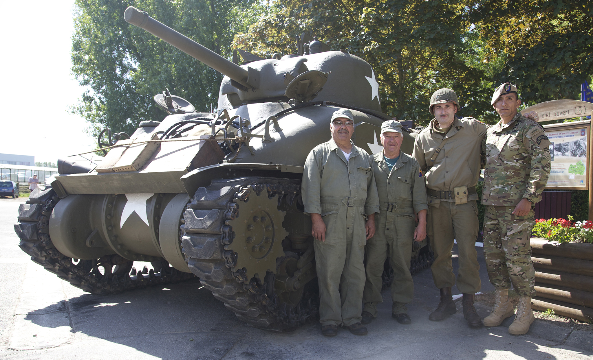 WWII reenactors and 1st Sgt. Alex Kupratty in Chef-du-Pont, France