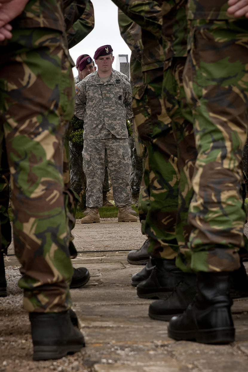 British and U.S. Soldiers participate in a ceremony in Graignes, France