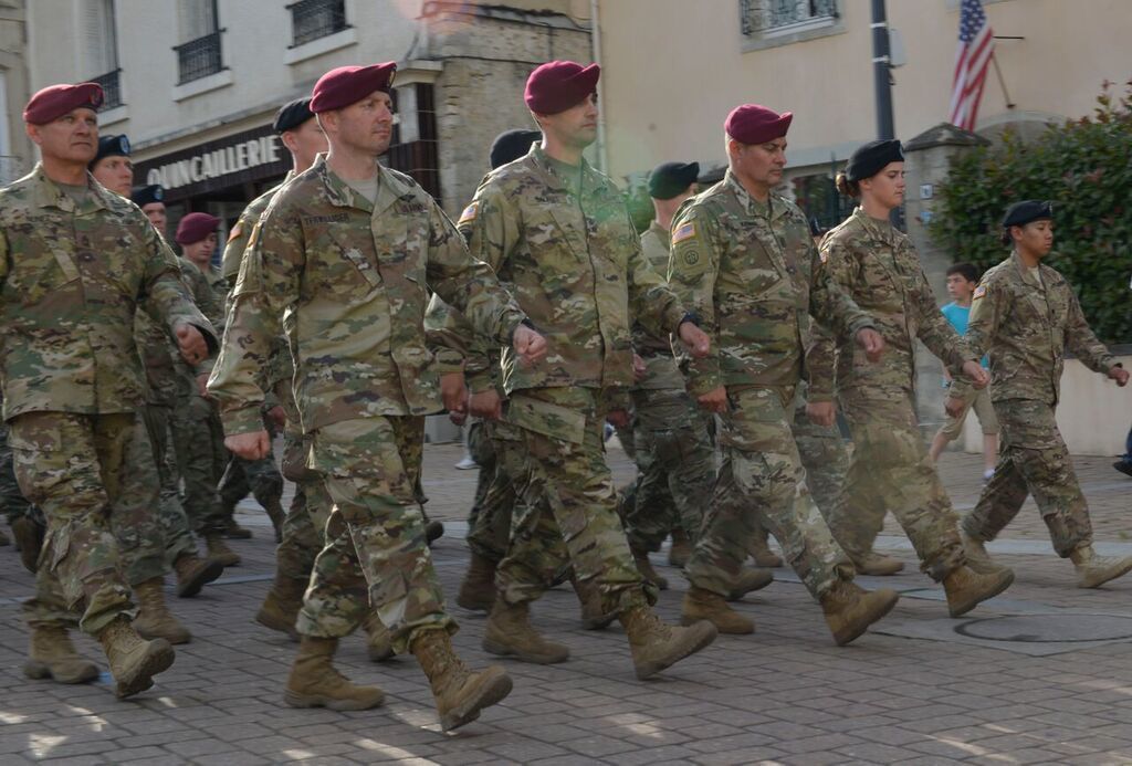 U.S. Army Soldiers march through Carentan, France