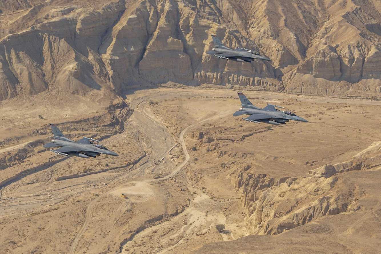 Air Force F-16 Fighting Falcons fly over the desert at Uvda Air Base ...