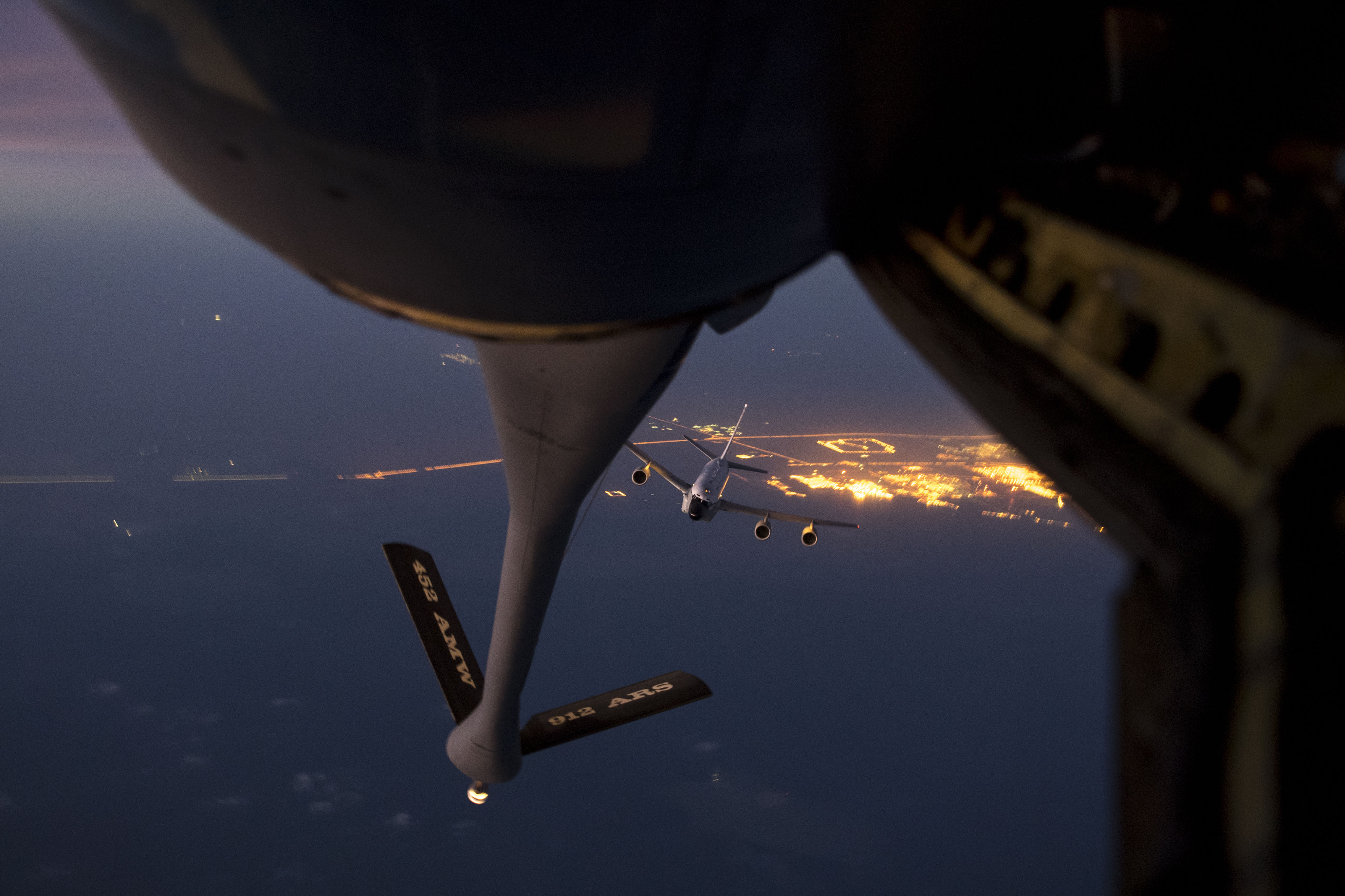 An Air Force RC-135 approaches the boom of a KC-135 Stratotanker during ...