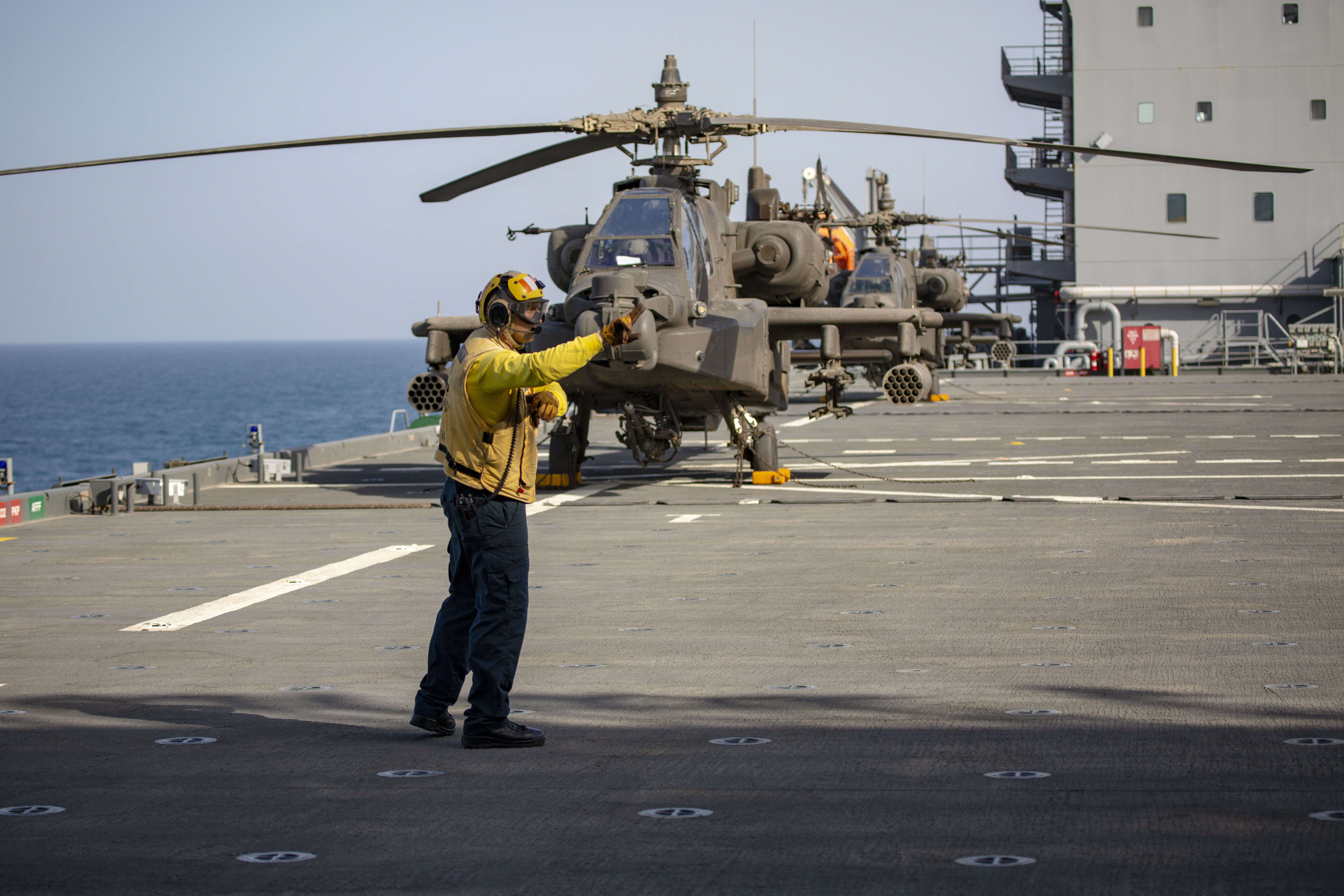 U.S. Army Apache helicopters complete landing qualifications aboard USS ...