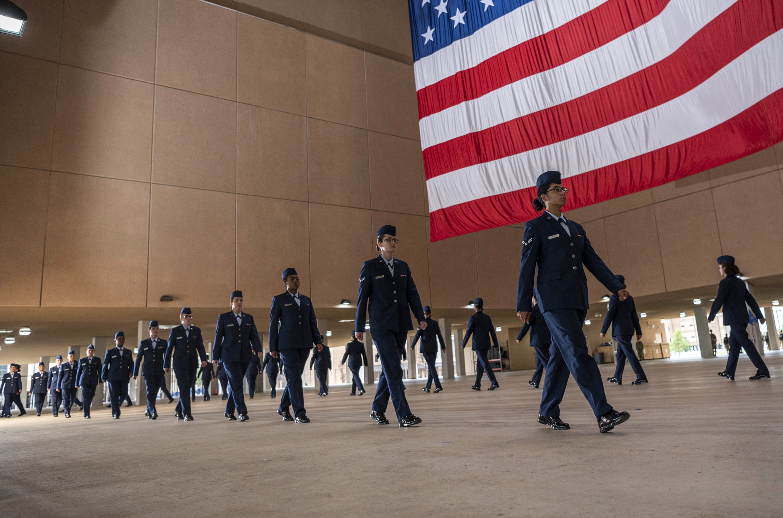 Airmen walk in formation during their basic military graduation