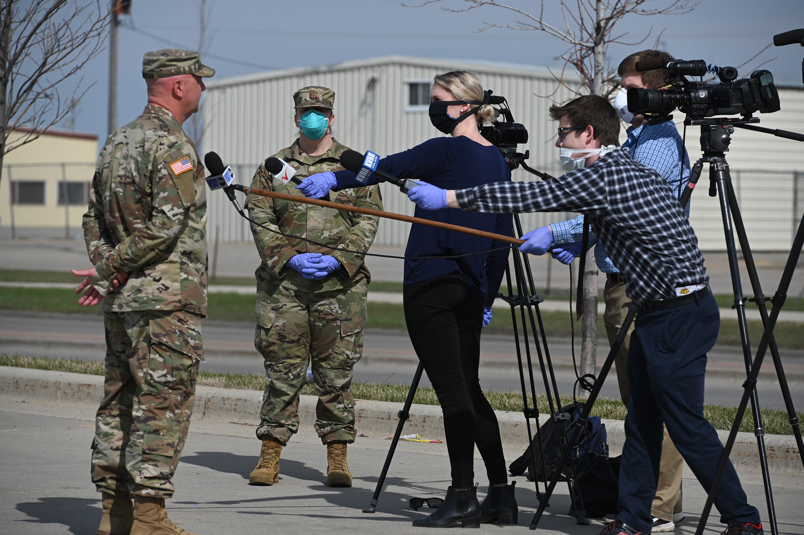 Maj Schatz assists media covering COVID-19