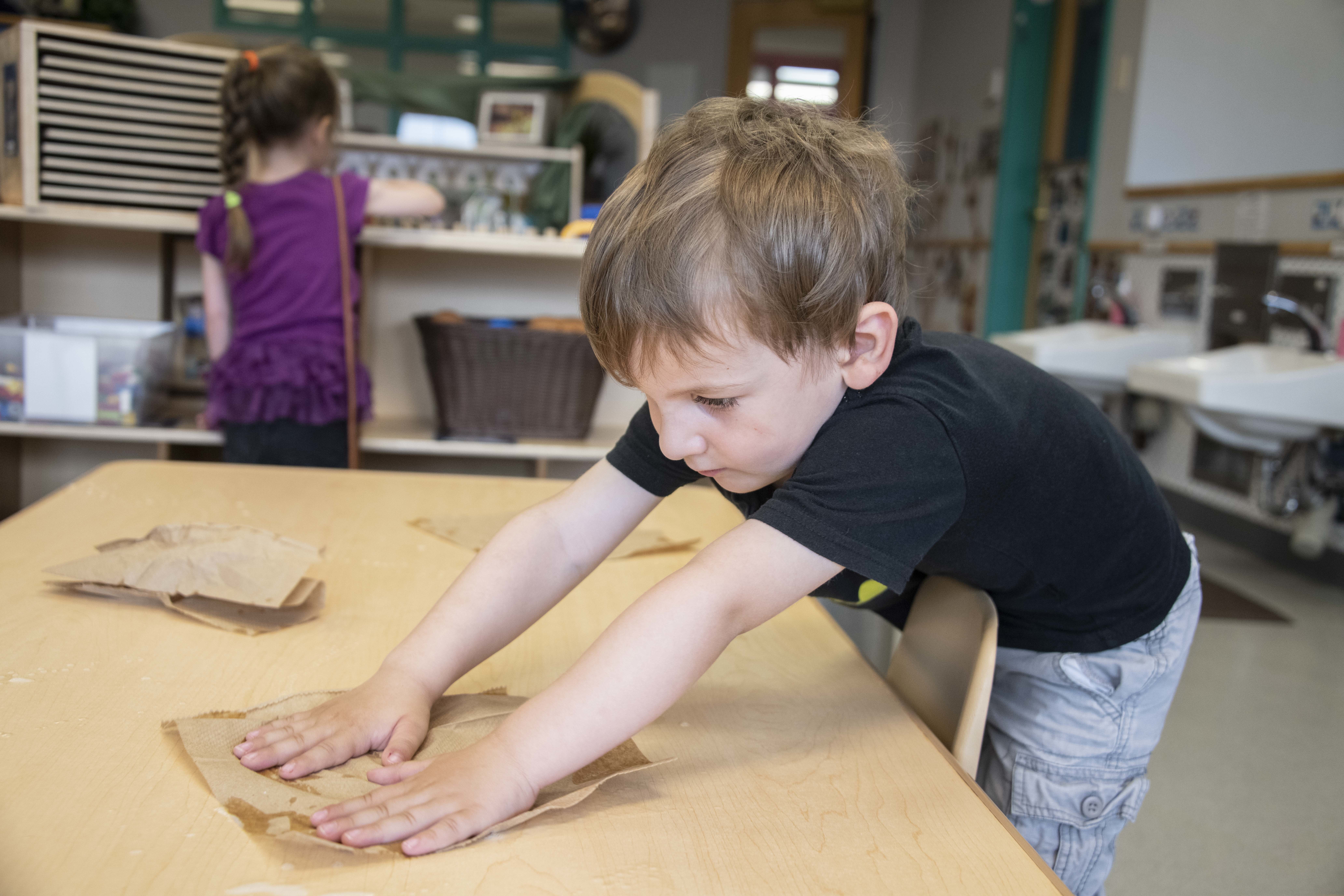 Boy Cleaning Table