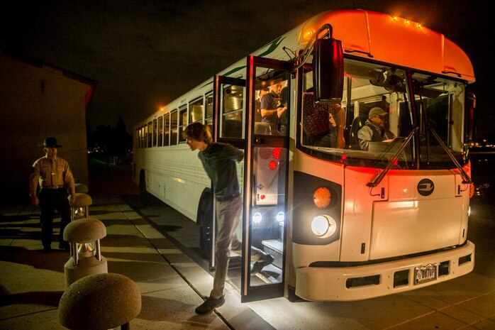 A new recruit with Alpha Company, 1st Recruit Training Battalion, steps ...