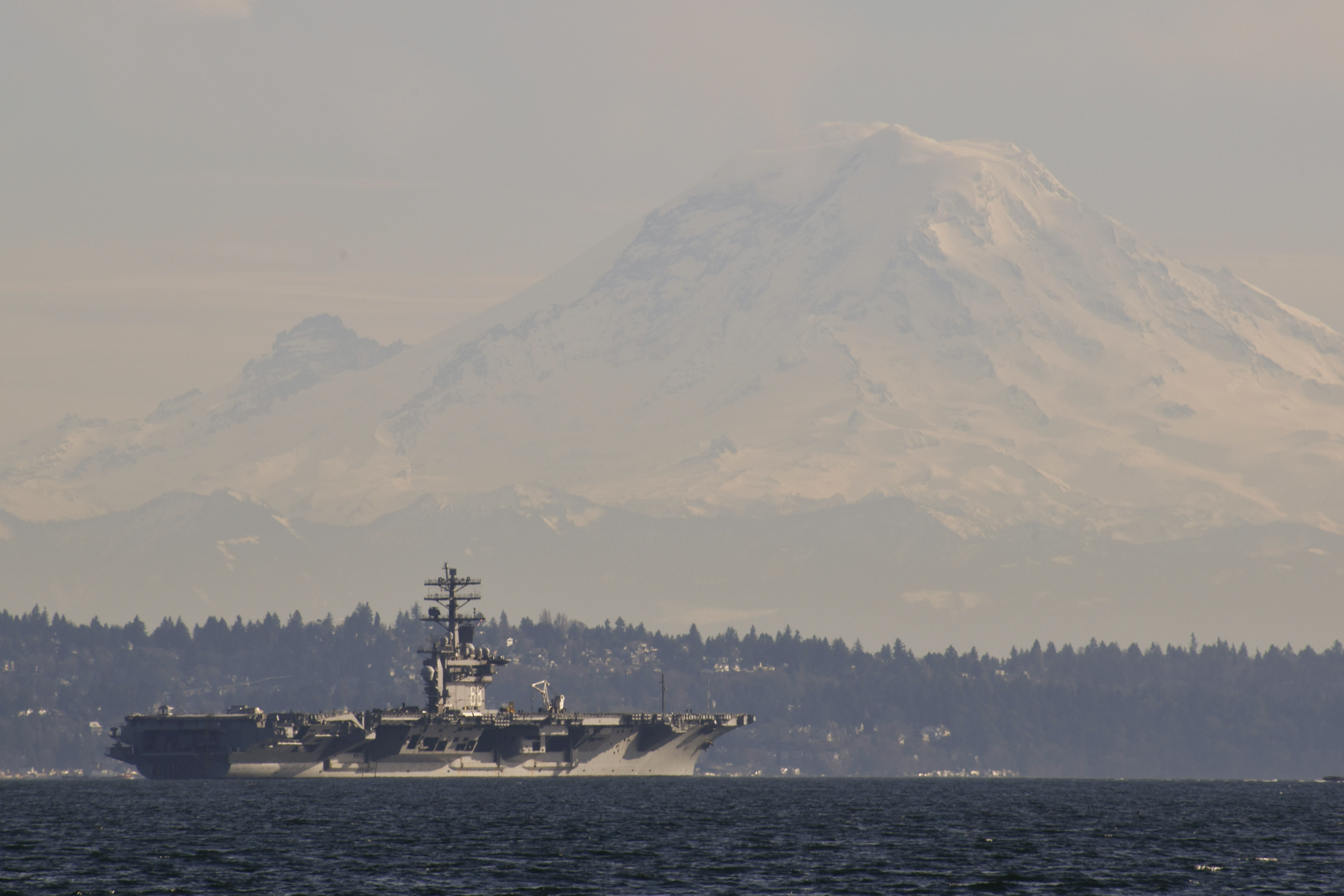 The USS Nimitz transits the Puget Sound, an inlet of the Pacific Ocean ...