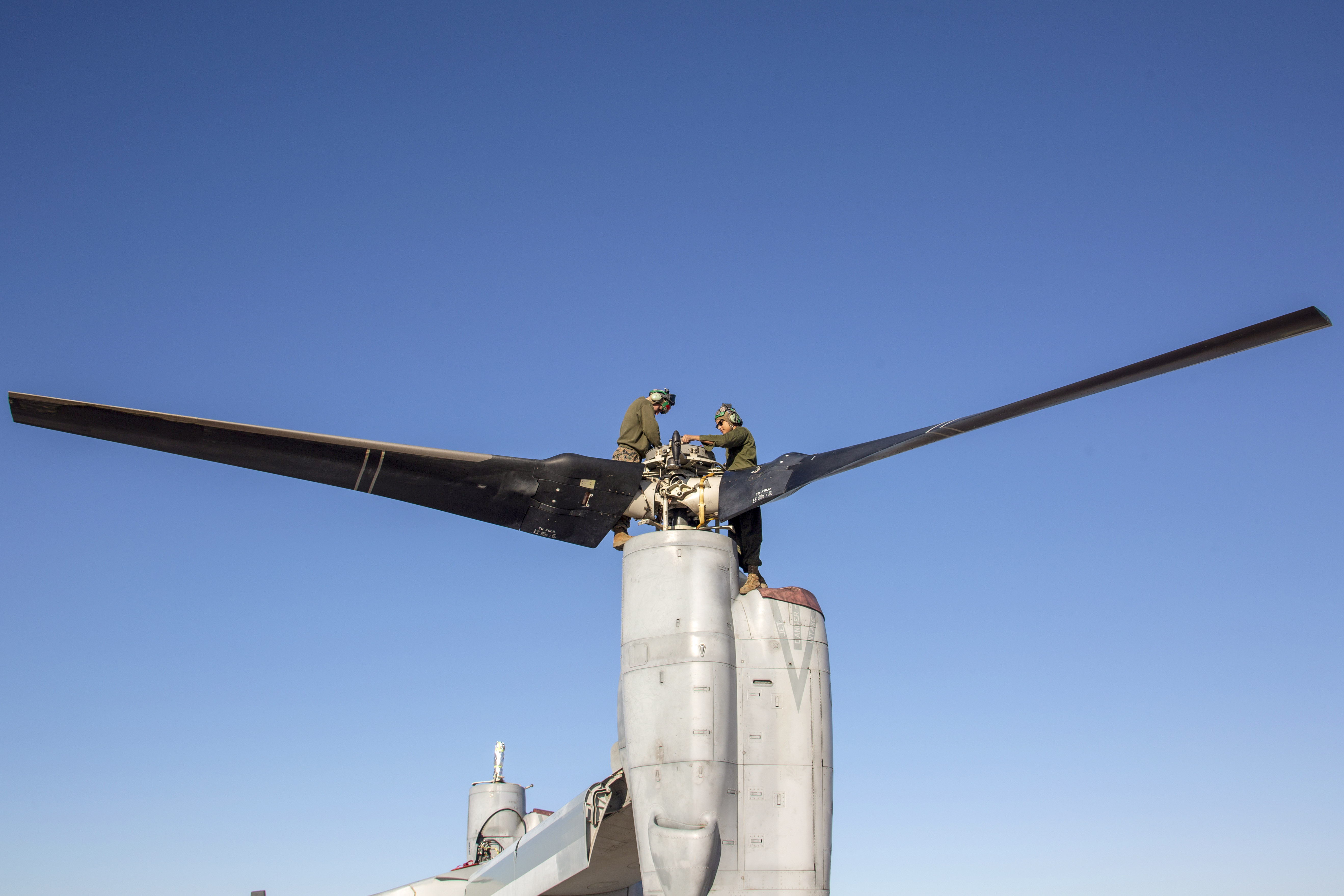 Marines perform maintenance on an MV-22 Osprey at Morón Air Base, Spain ...