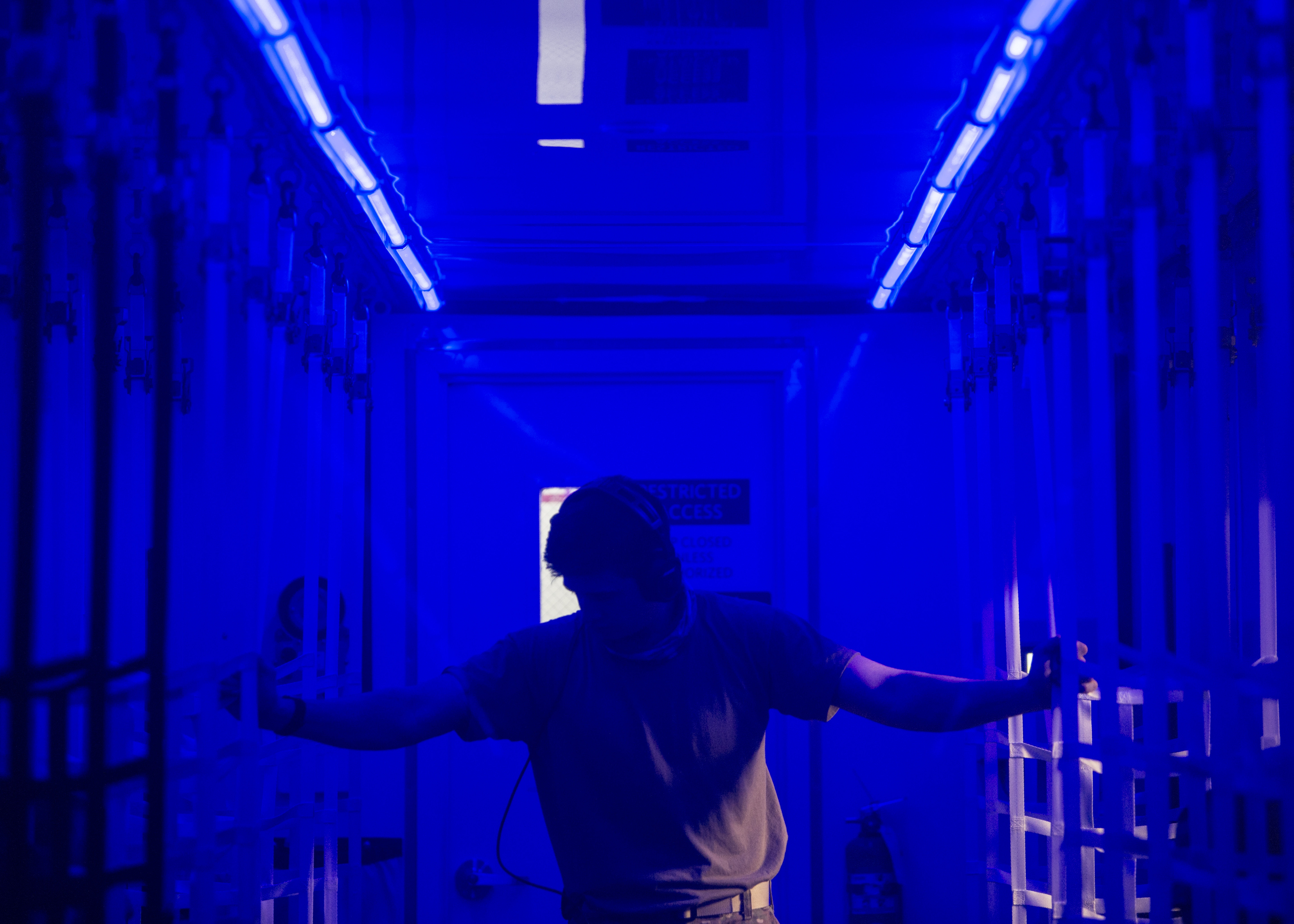 Lab testing medical equipment in new isolation container prototypes ...