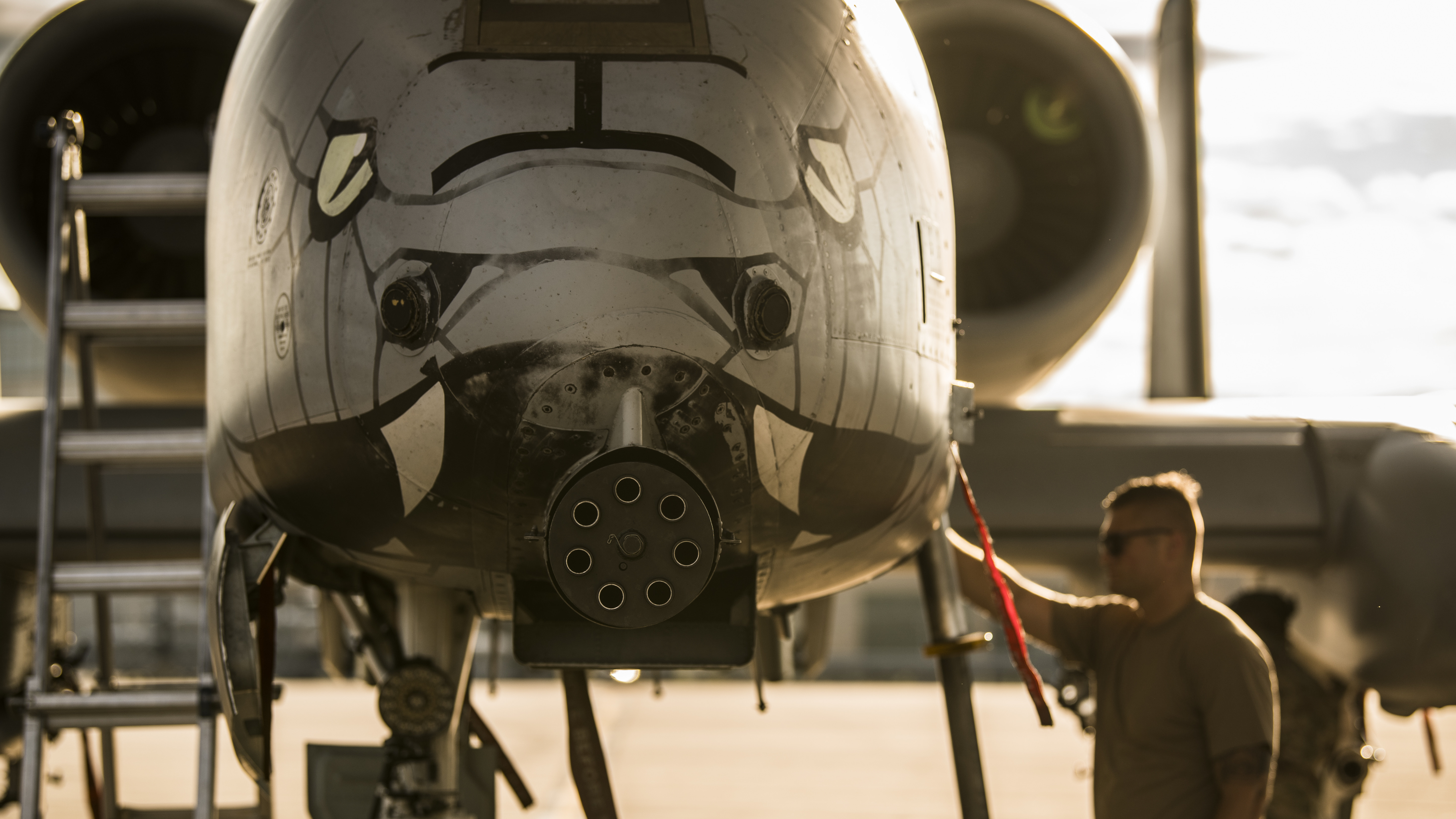 Aircraft maintenance crew chief performs a preflight inspection on an A ...