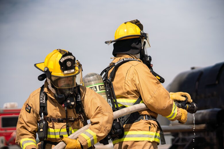 Firefighters conduct live-fire exercise on mobile aircraft trainer ...