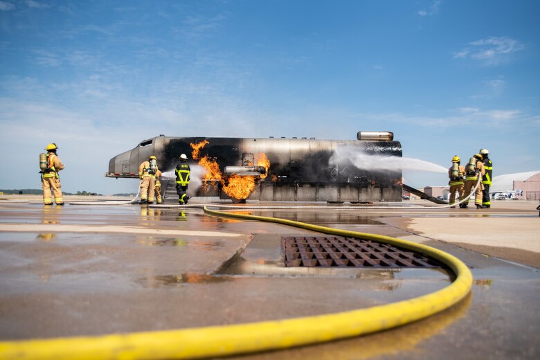 Firefighters conduct live-fire exercise on mobile aircraft trainer ...