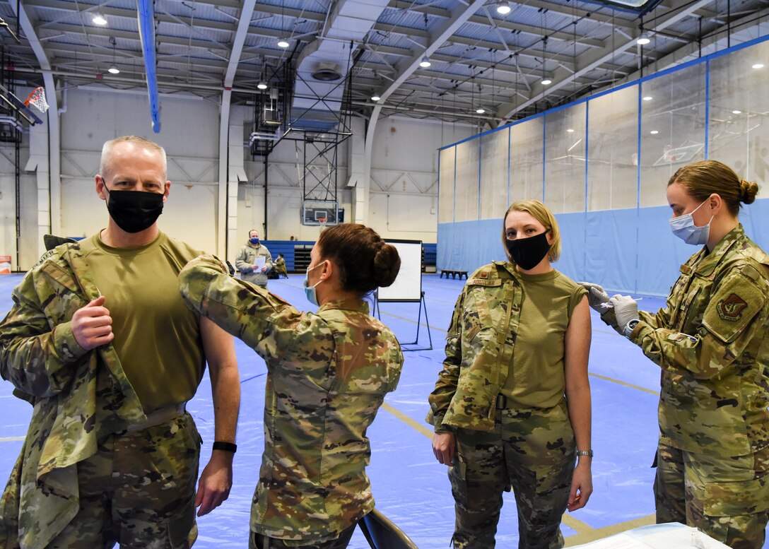 JBER leadership receives first of two-dose COVID-19 vaccine