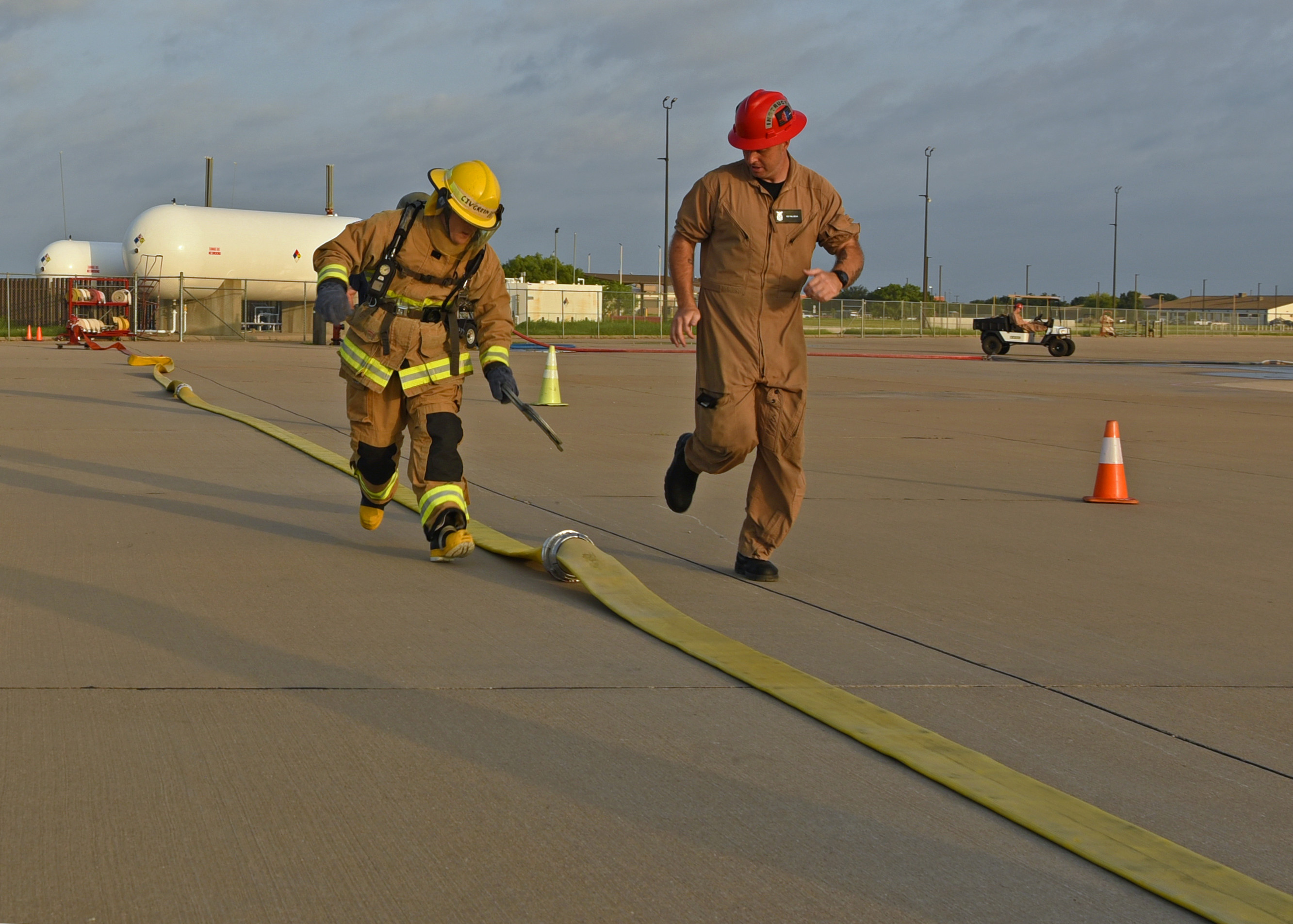 Fire academy students train strength, endurance with hose pulls ...