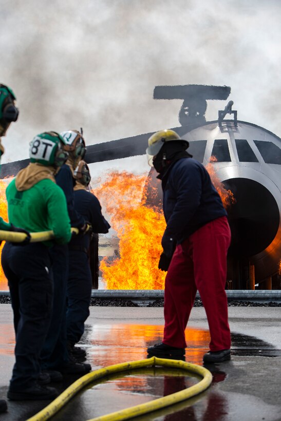 U.S. Navy Sailors with Fleet Logistics Support Squadron (VRC) 30, DET-5 ...