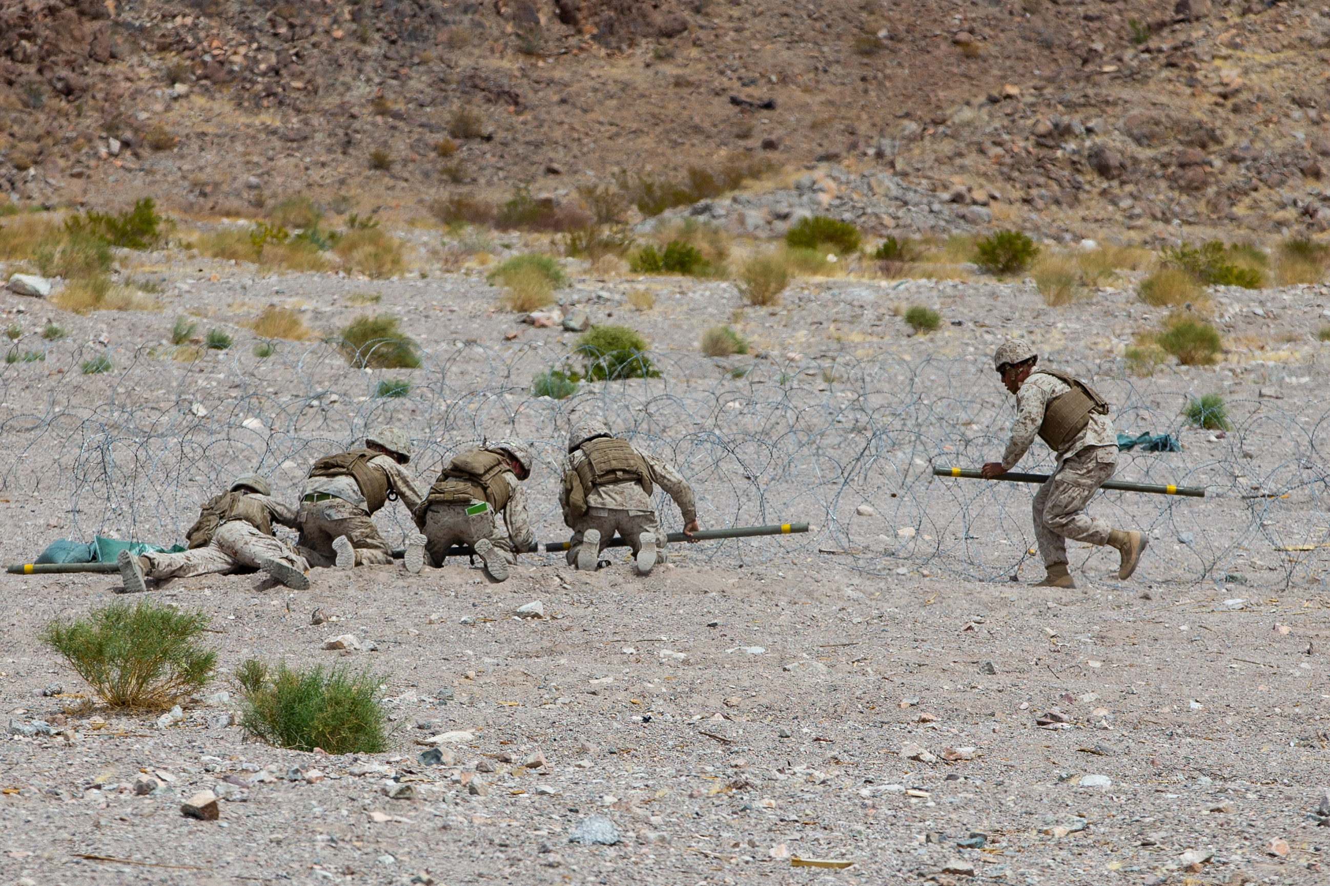 Marines clear obstacles with explosives