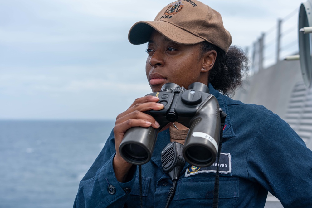 USS Jackson (LCS 6) Sailor Stands Starboard Lookout