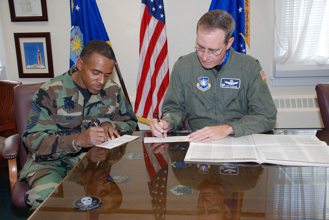 Col Morgan signing document