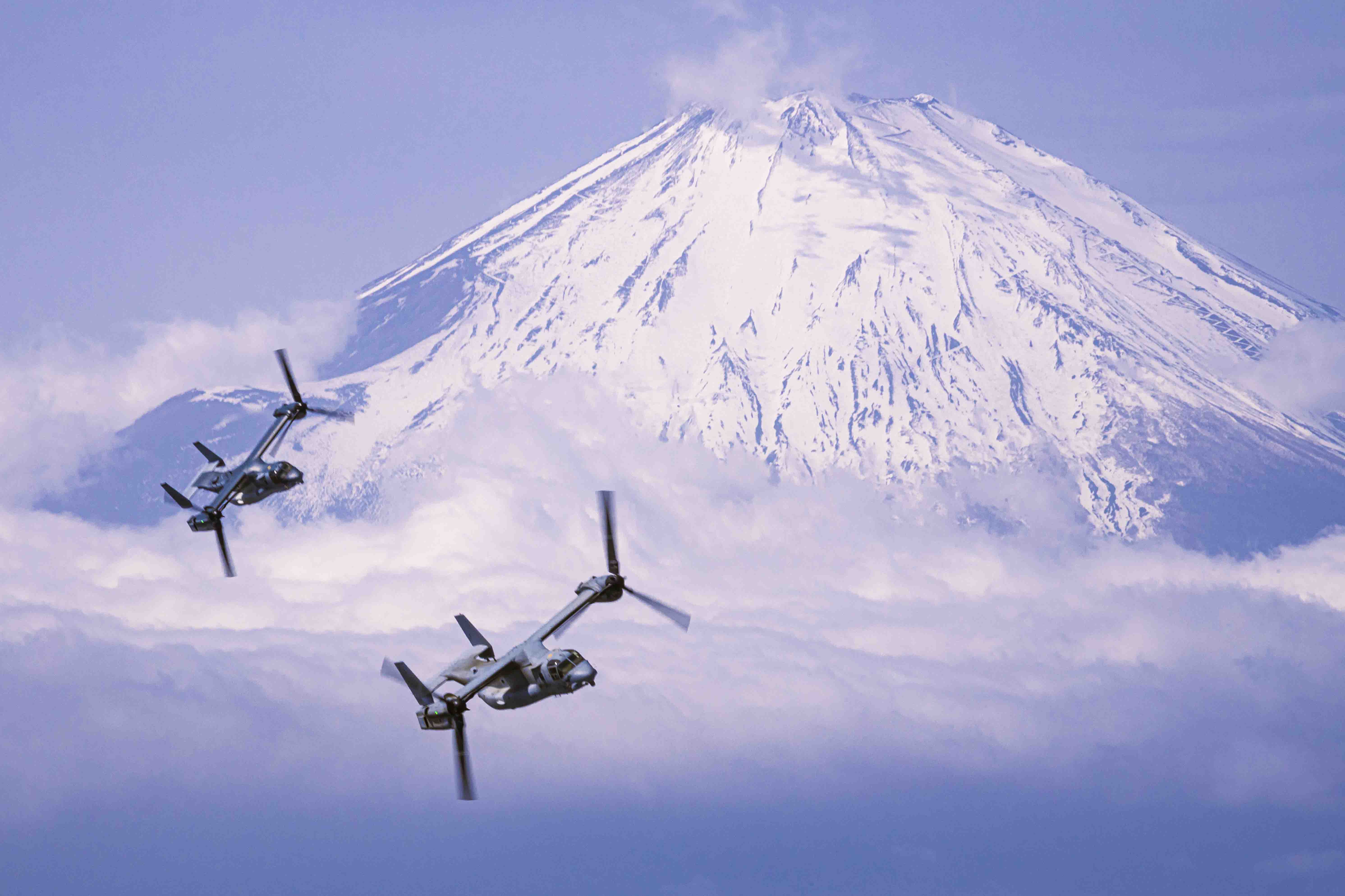 A Marine Corps MV-22B Osprey and a Japanese V-22 Osprey conduct a ...
