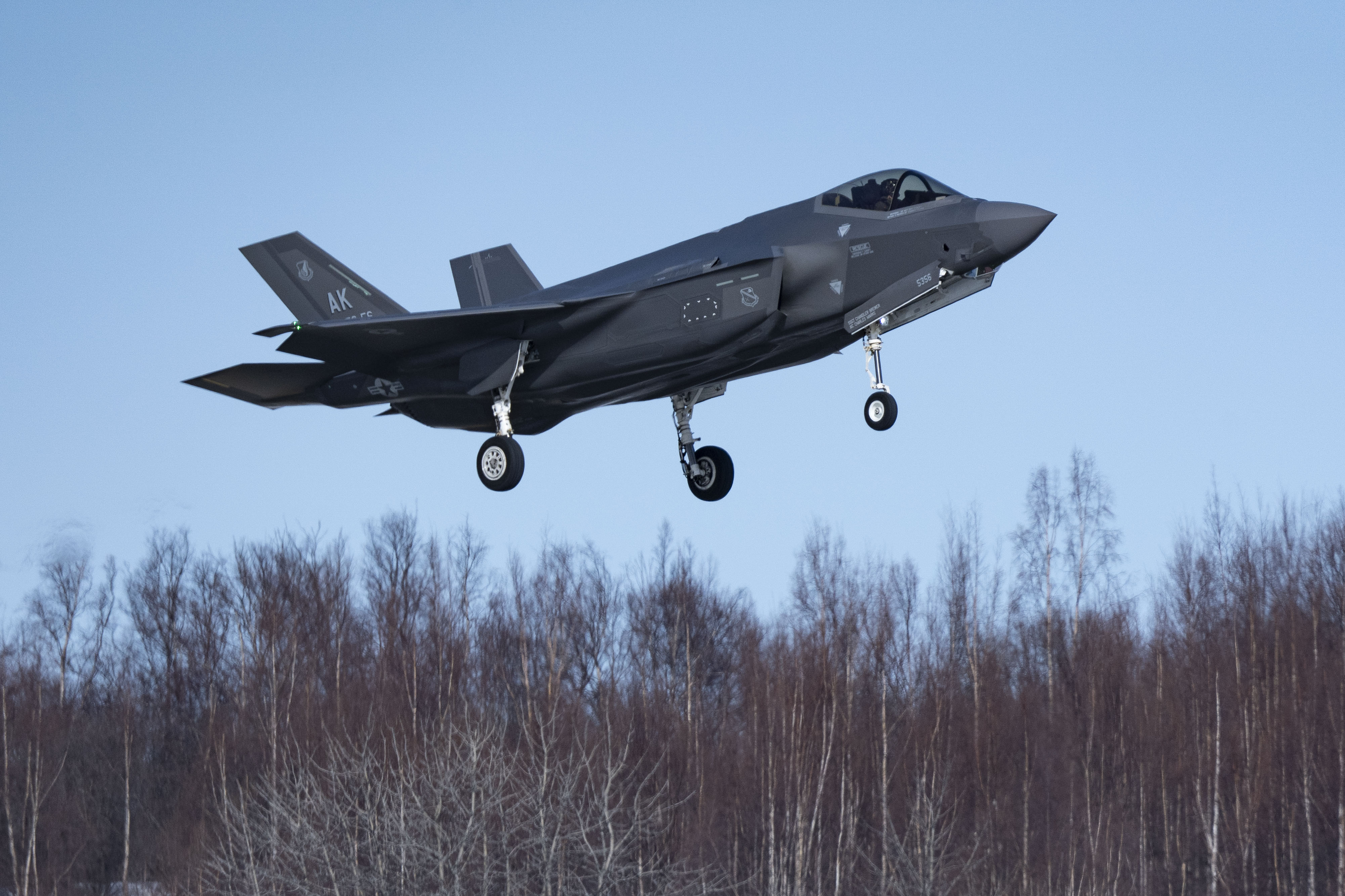 F-35s conduct hot-pit refueling while JBER aircraft maintain Air
