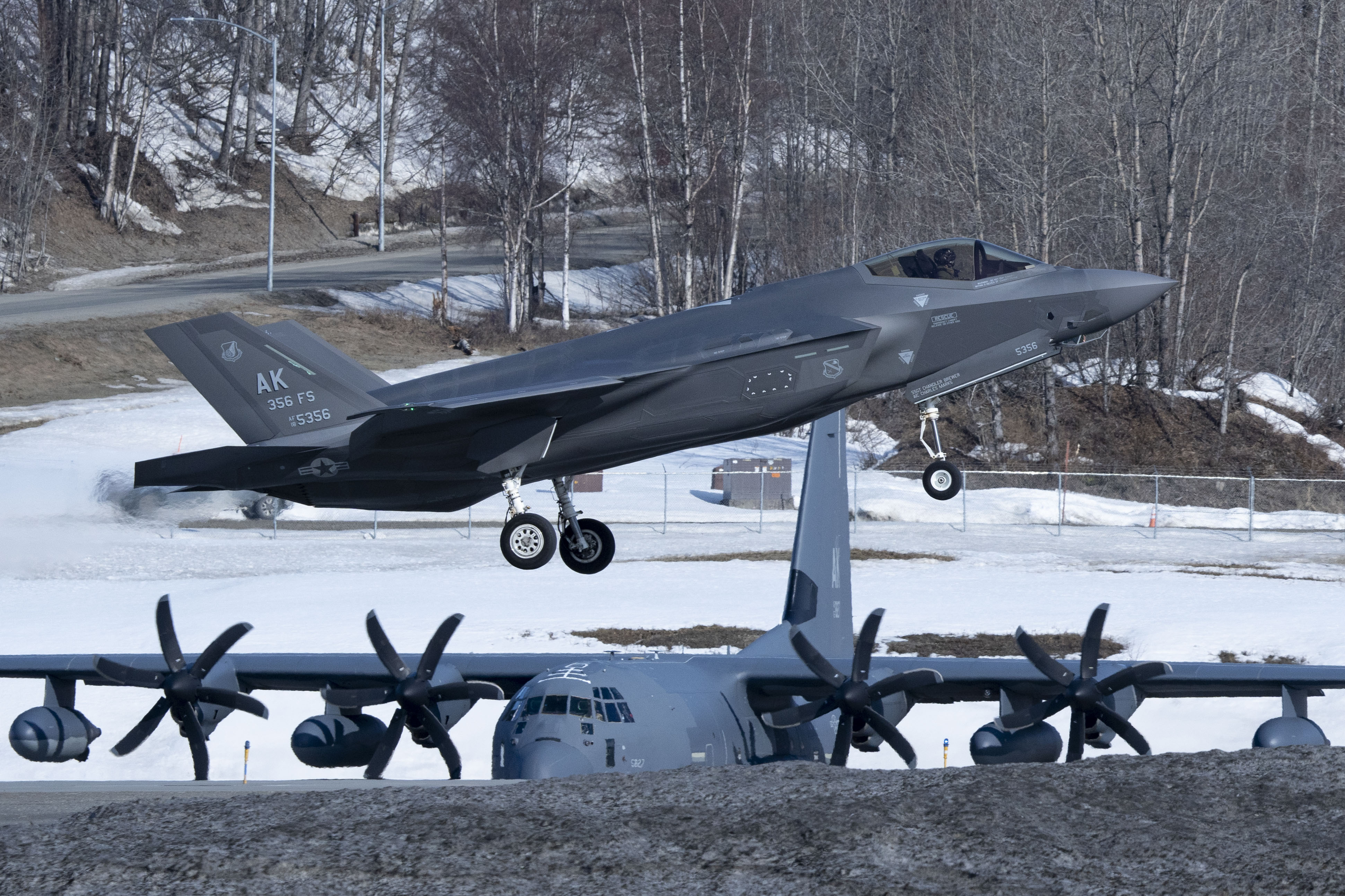 F-35s conduct hot-pit refueling while JBER aircraft maintain Air
