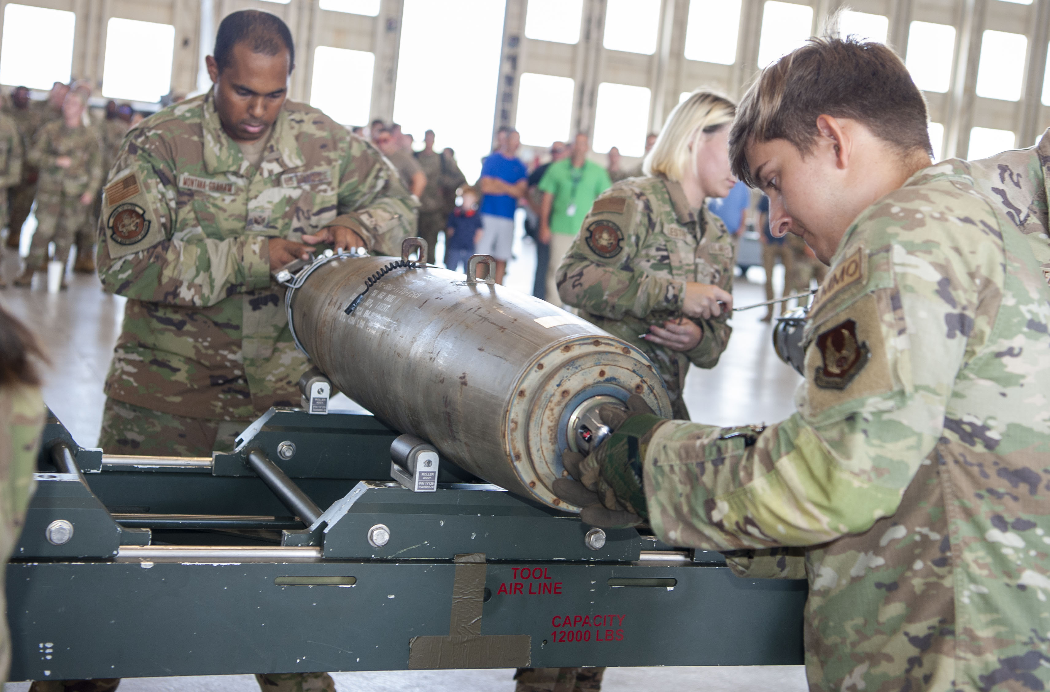 Maintainers hold weapons load, bomb building events > Air Force ...