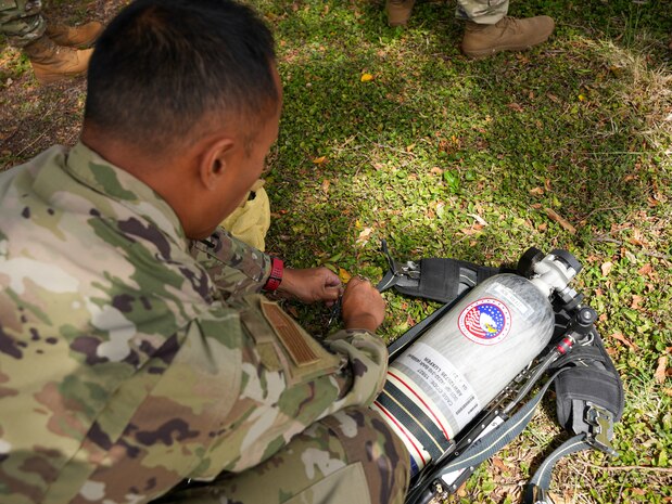 JTF-RH roving security and fire watch team members conduct SCBA ...