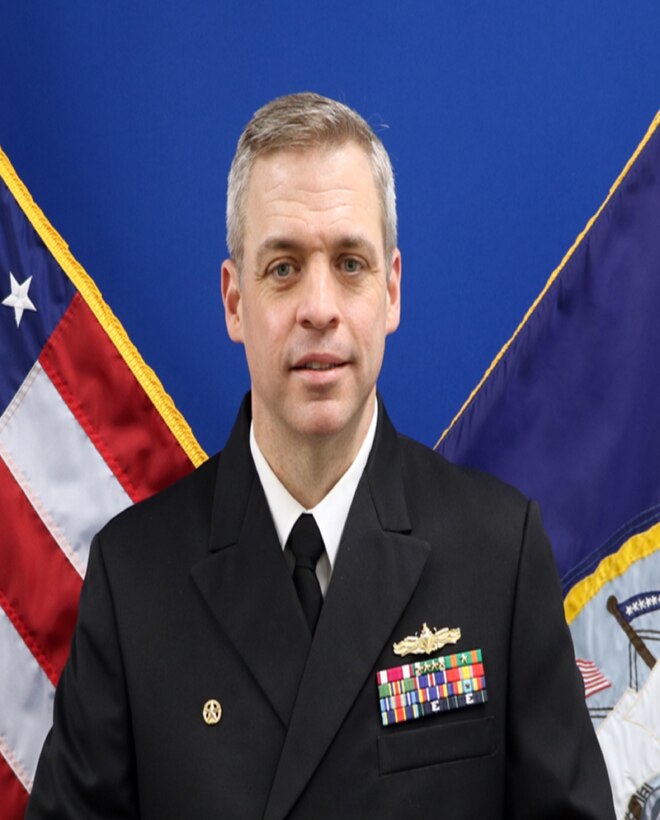 Commander Dustin T. Smith