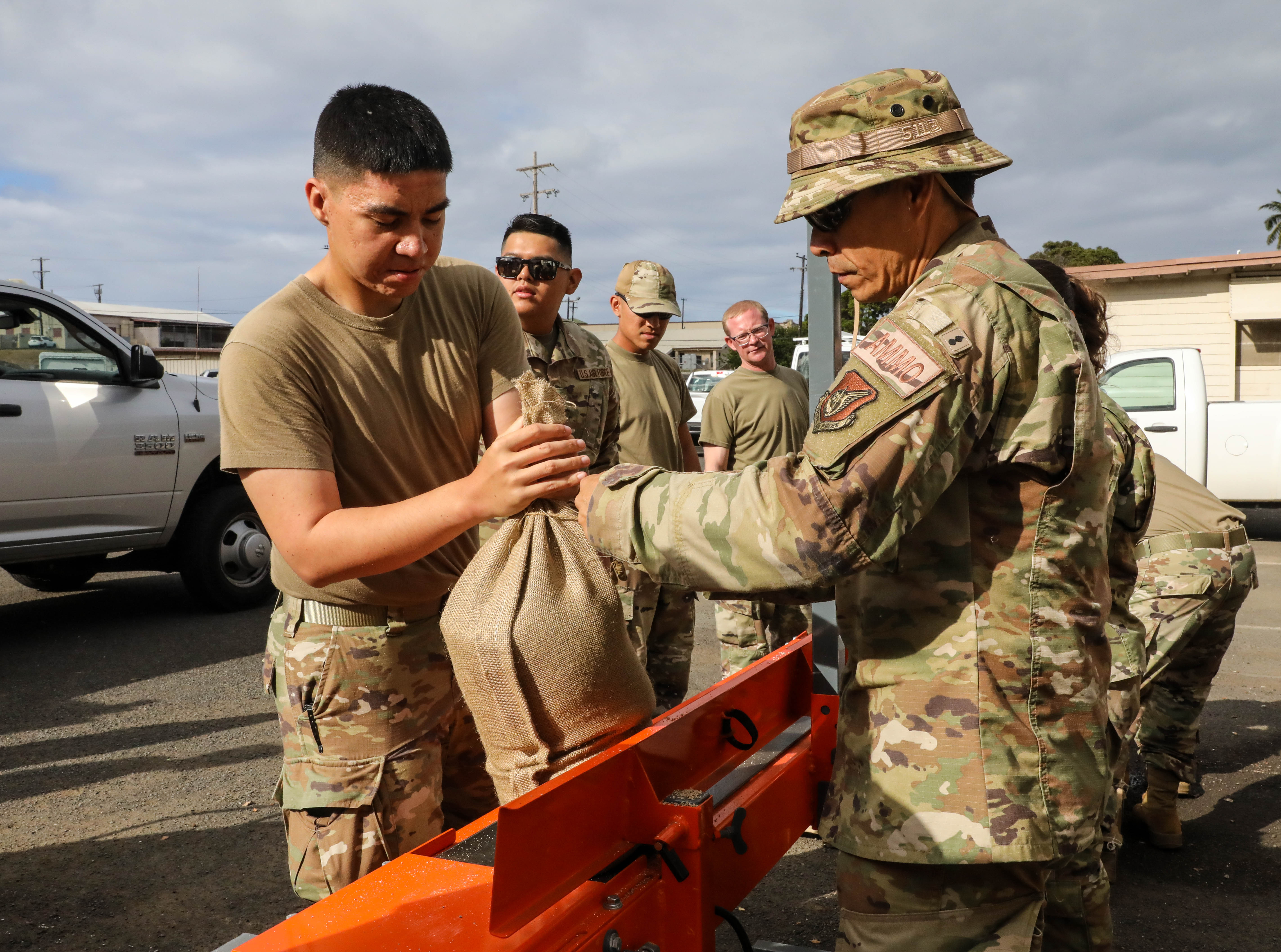 Joint Task Force-Red Hill personnel, assemble sandbags in preparation ...