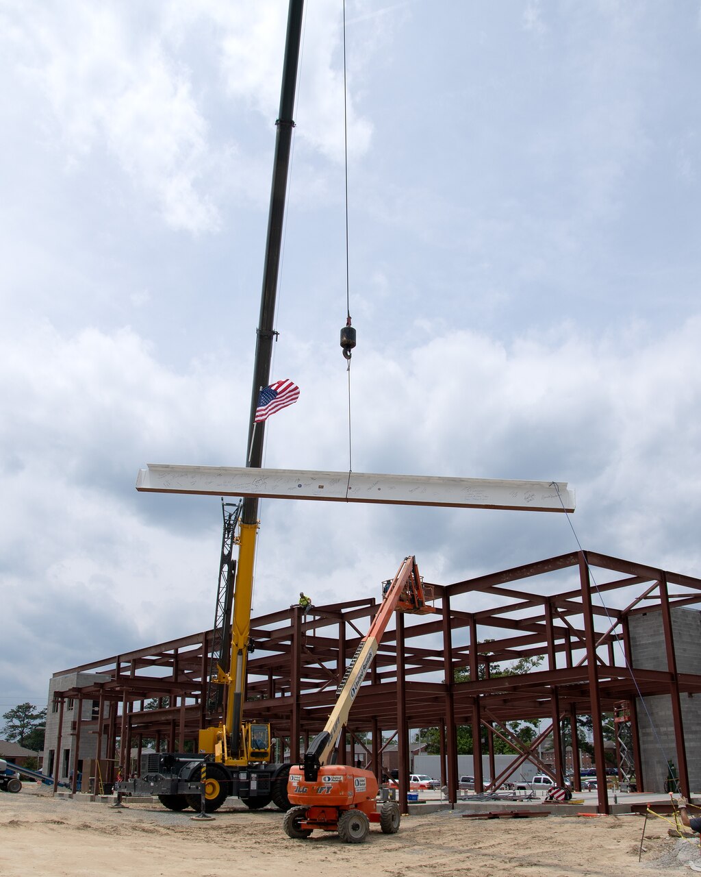 New Legal Services building receives special beam commemorating ...