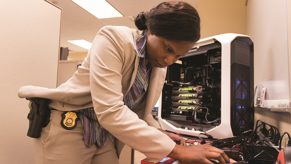 A CID Special Agent processes evidence at the Computer Crime ...