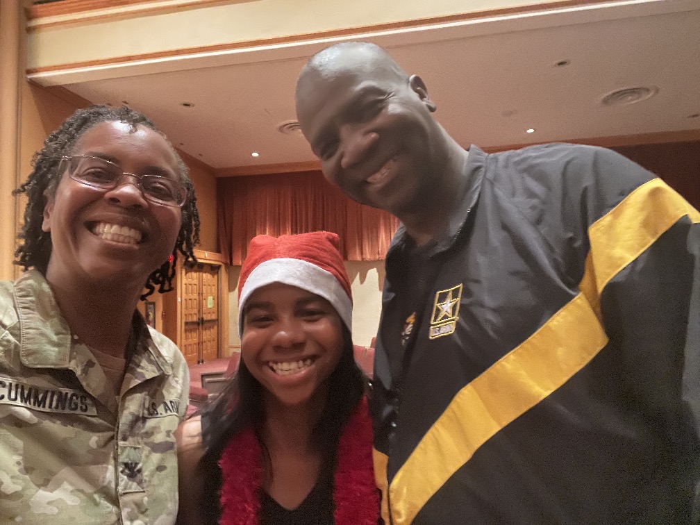Col. Dominique Cummings with her husband and daughter