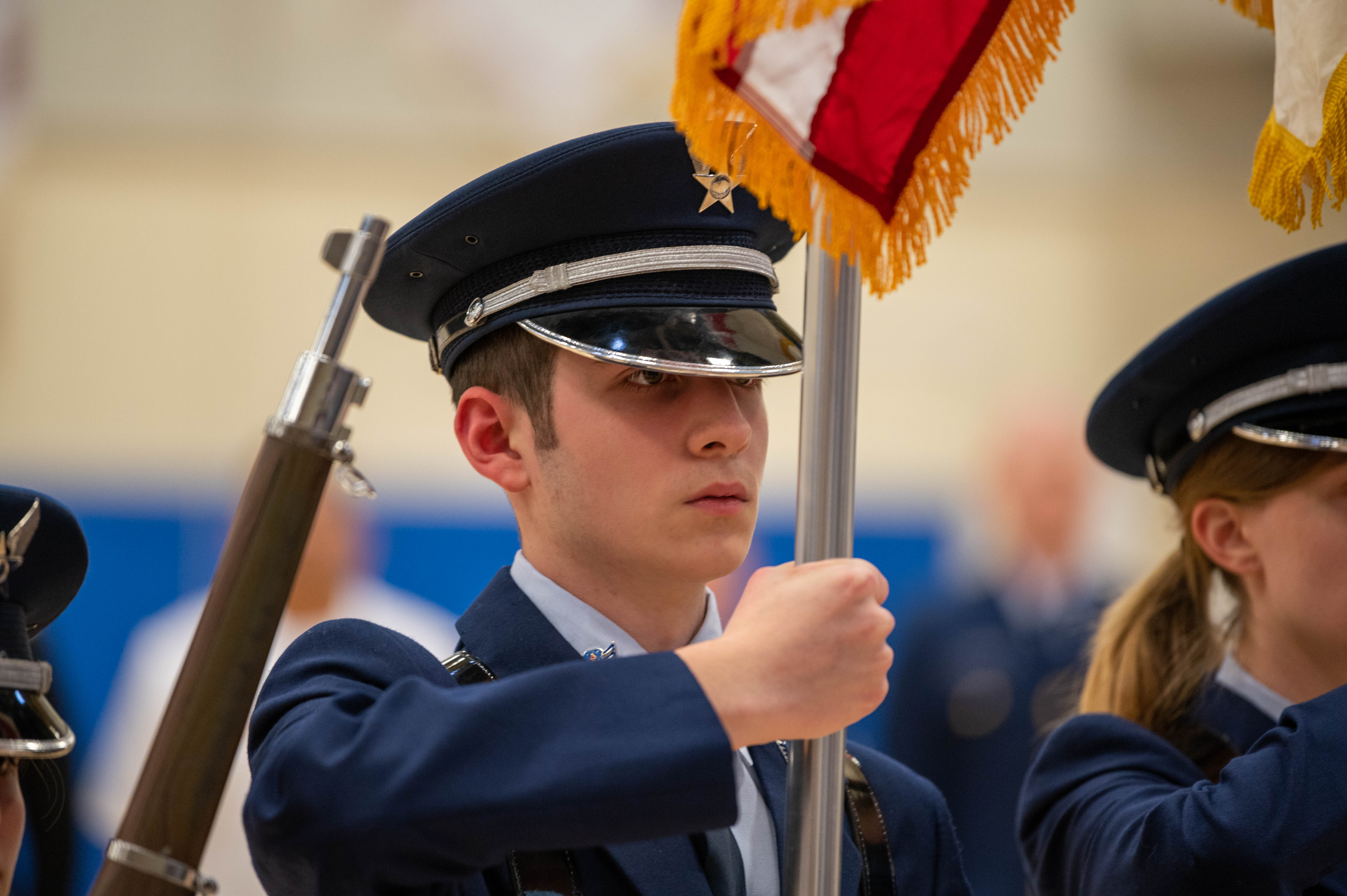 Airman thanks Yokota educators for 50 years of service with combat flag ...