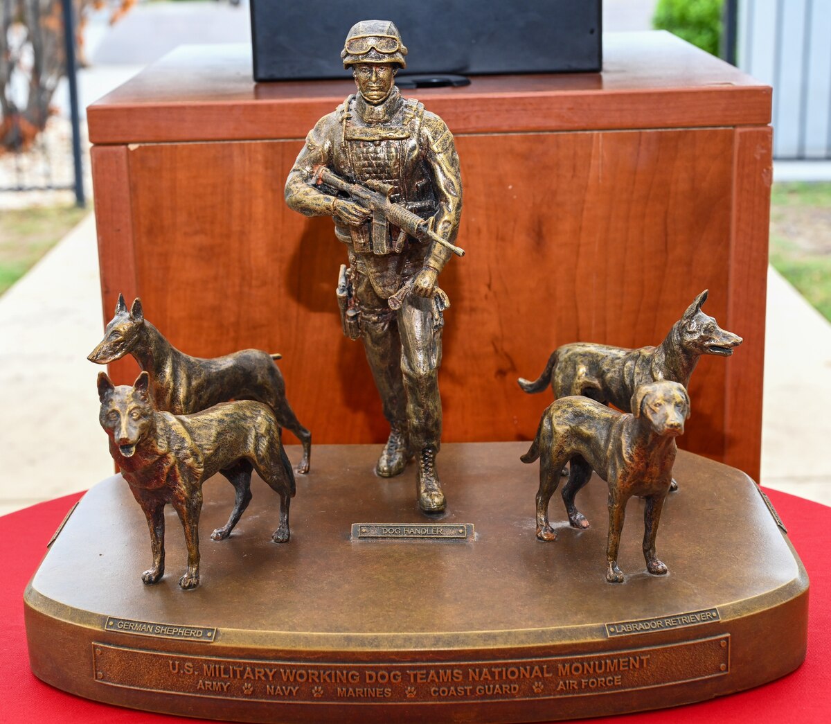 dog handler statue