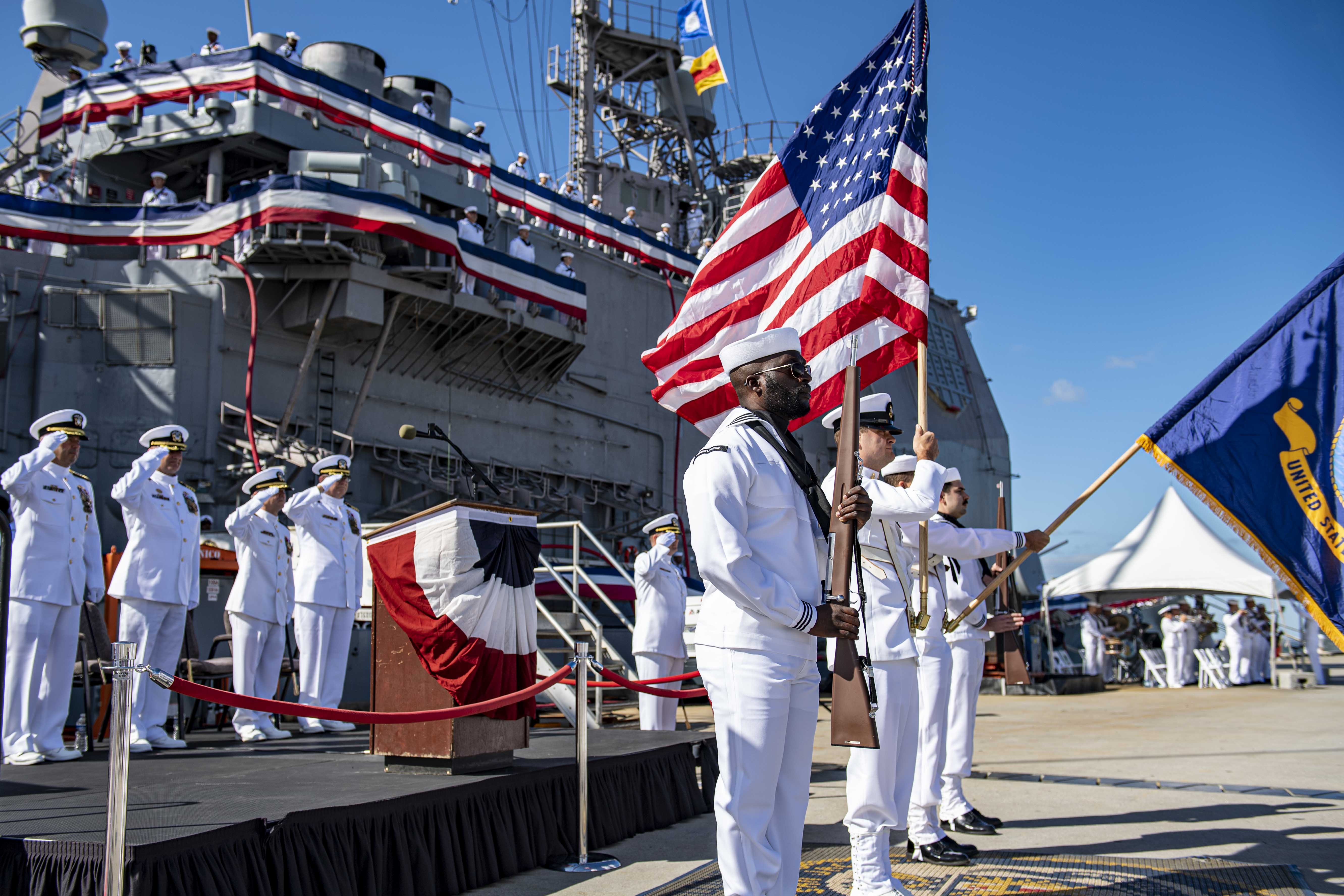 Sailors participate in the national anthem during the decommissioning ...