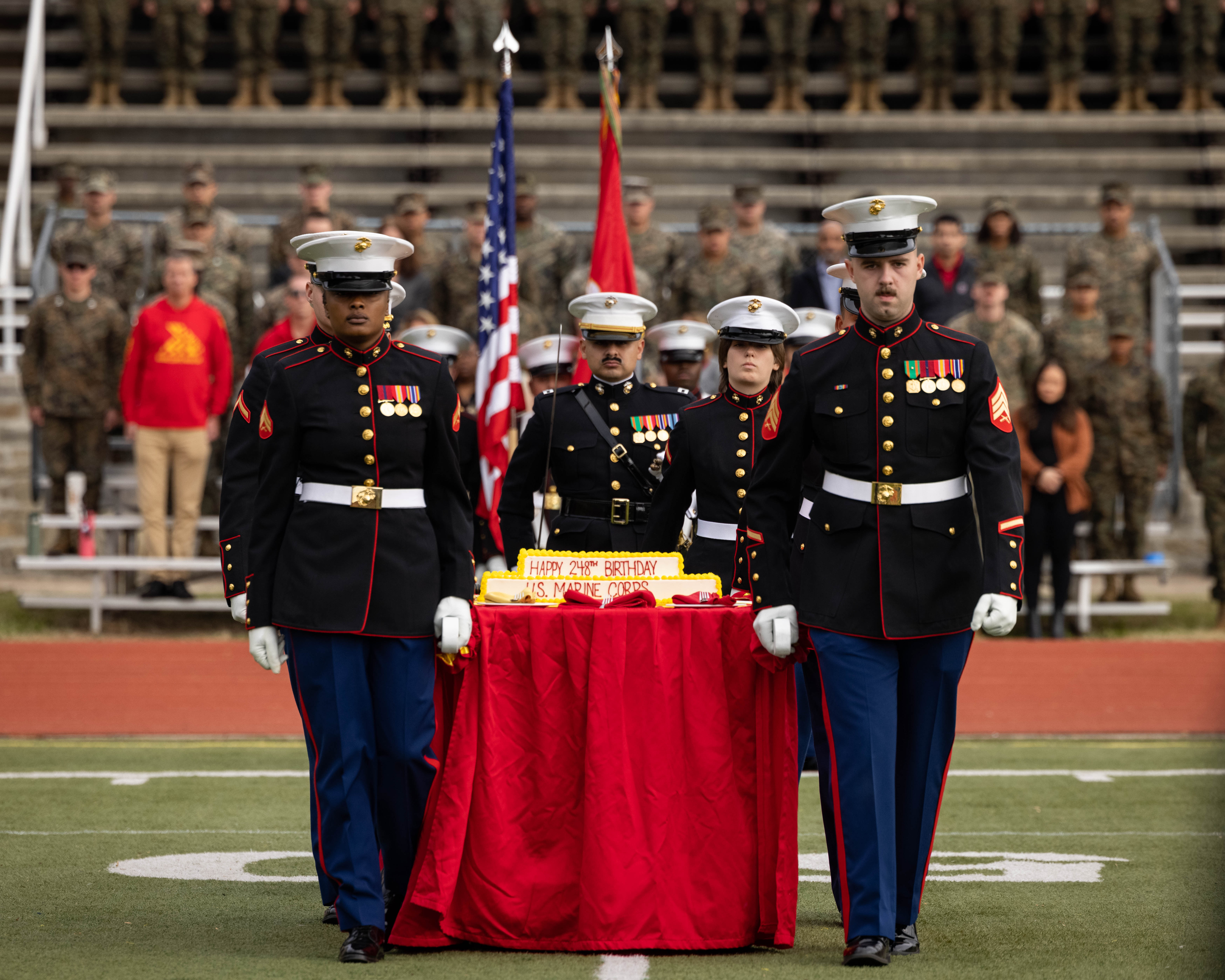 U.S. Marines present the cake during the Marine Corps cake cutting ...
