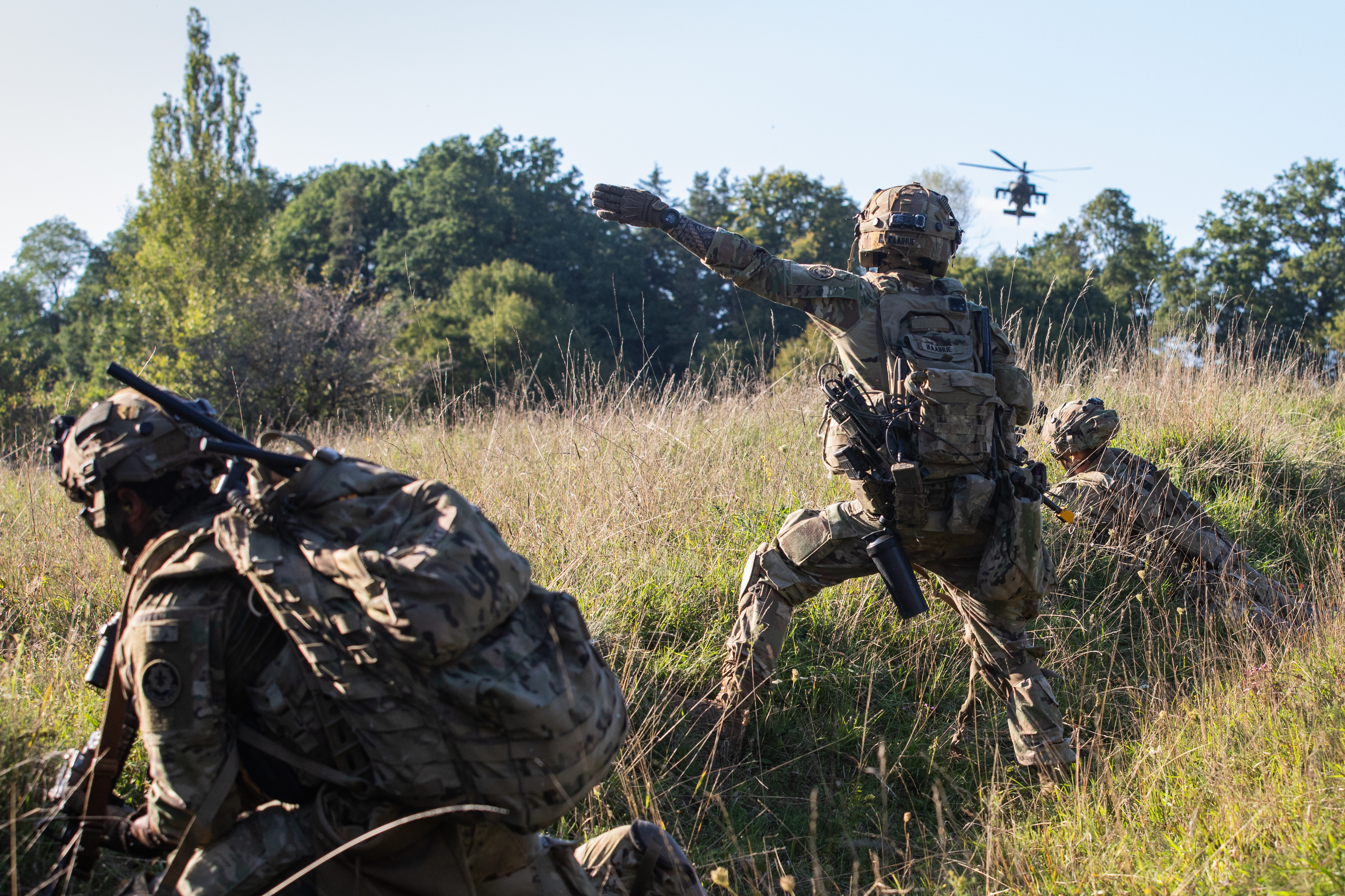 A U.S. Army soldier assigned to the 2nd Cavalry Regiment signals to the ...