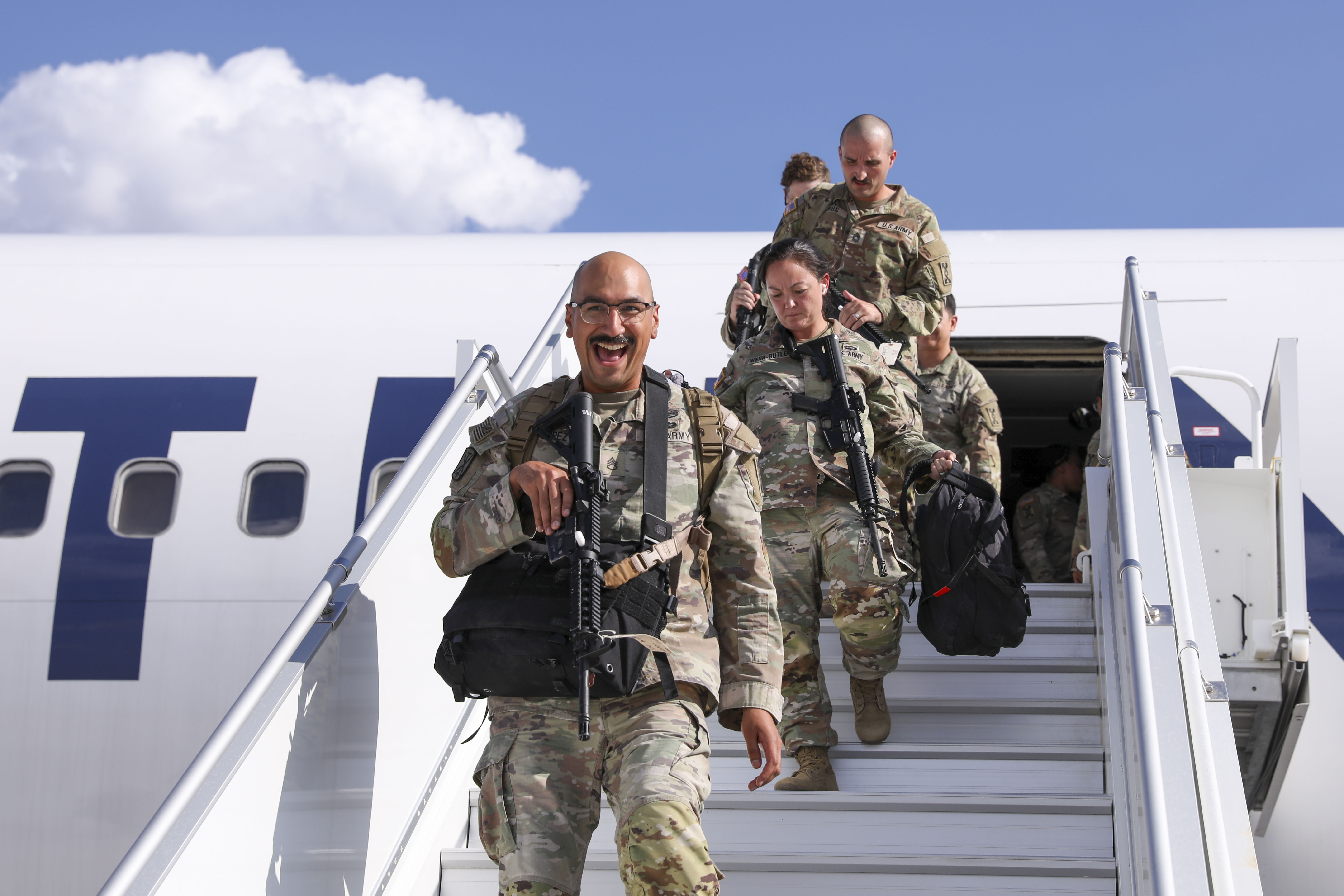 U.S. Army Reserve Soldiers assigned to the 143d ESC, return home from ...