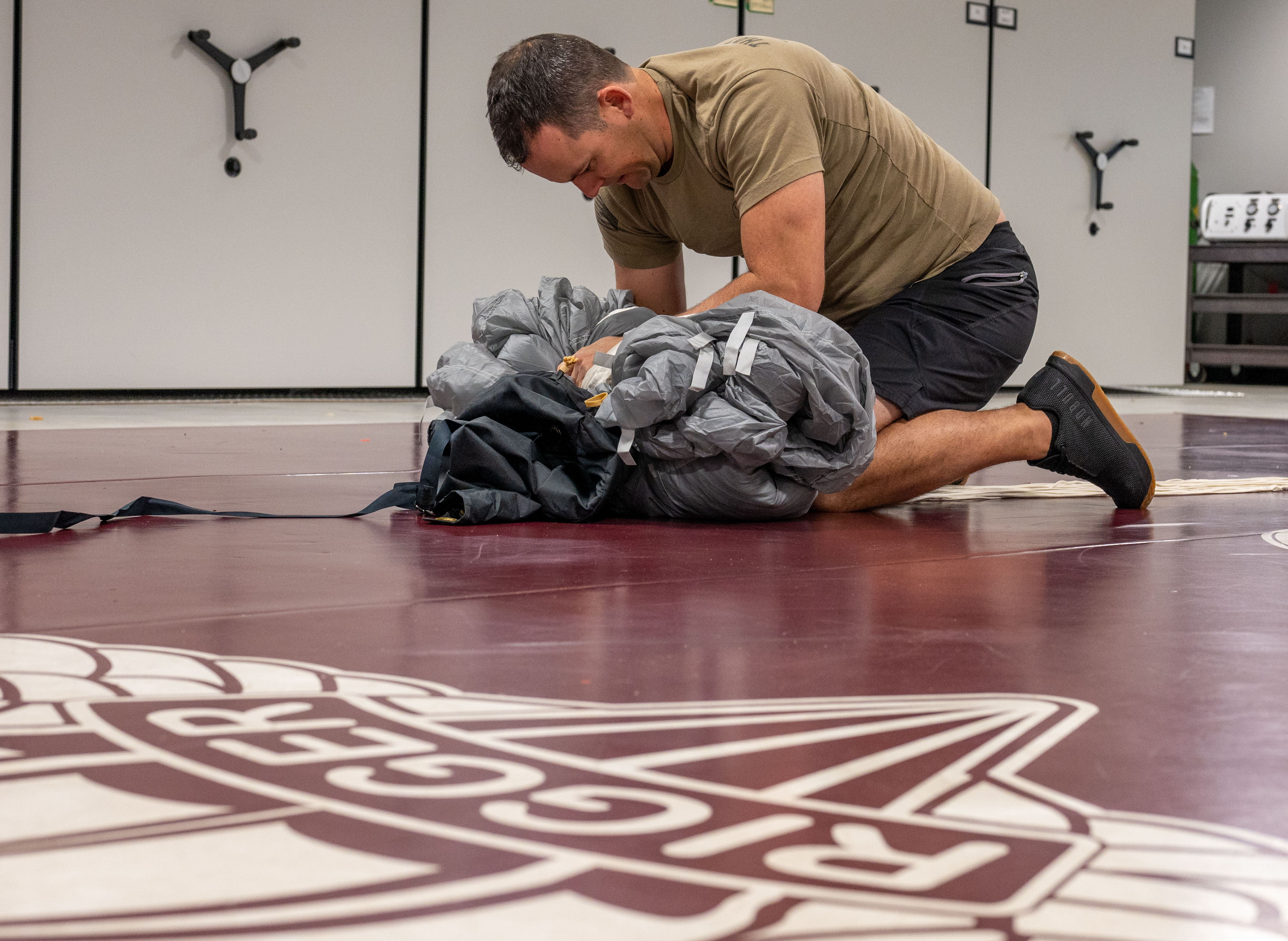 Parachute packers become airborne qualified to improve equipment ...