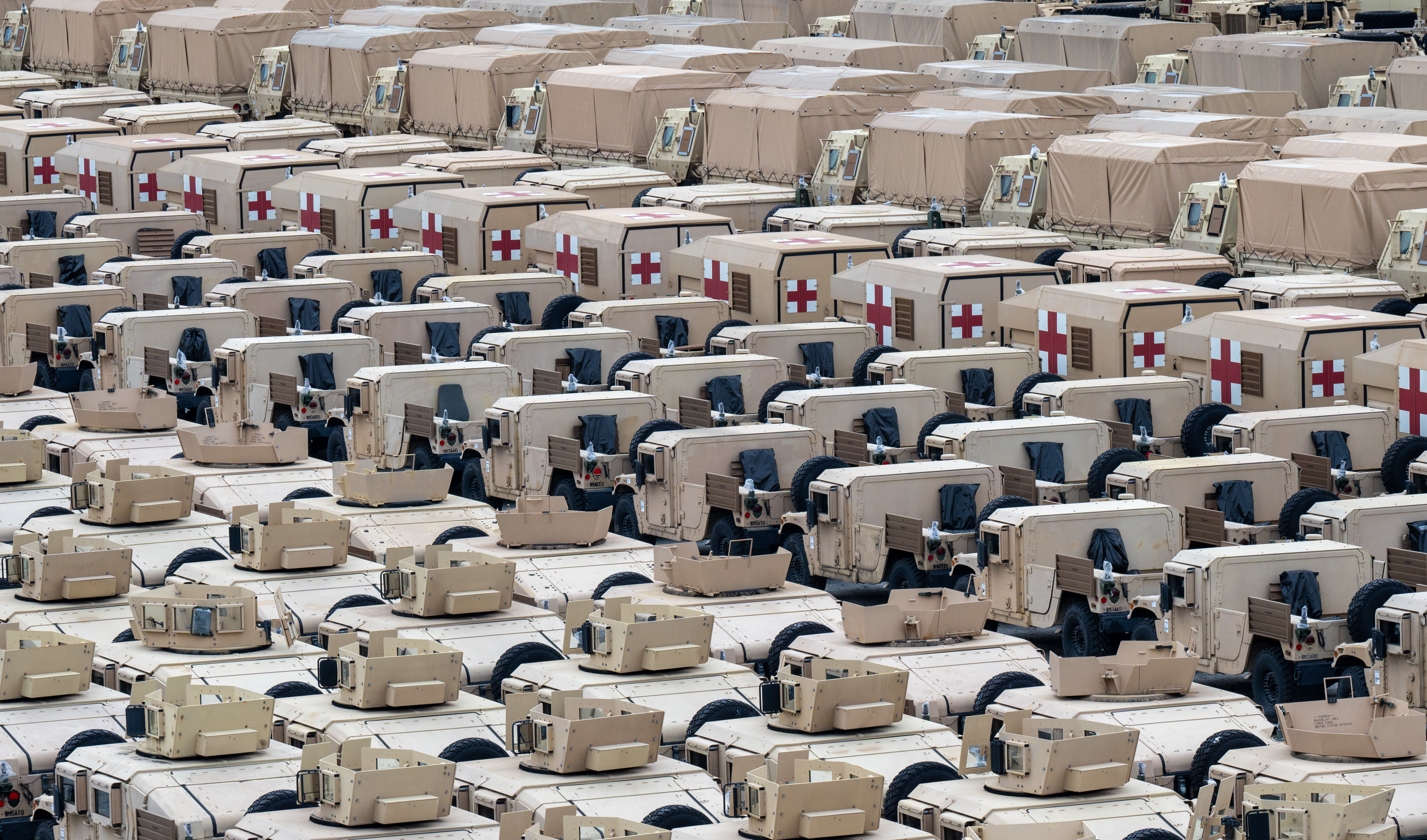 DoD, contracted personnel load hundreds of U.S. Army equipment aboard ...