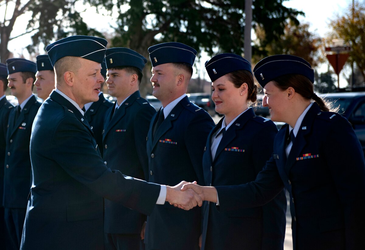 Class 25-03 students pin on wings following their graduation ceremony ...