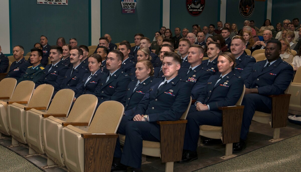 Class 25-03 students pin on wings following their graduation ceremony ...