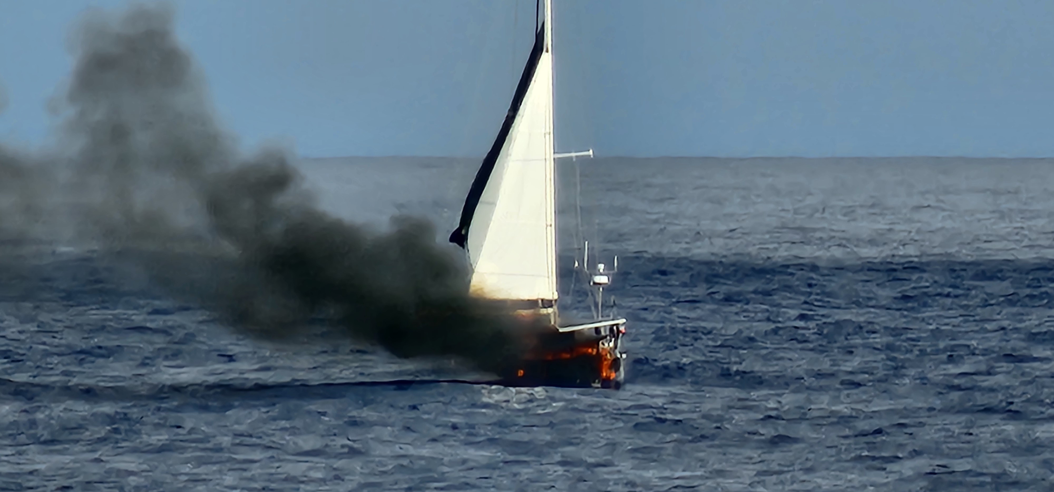 Coast Guard, tanker ship Orange Ocean rescue boater from vessel on fire ...