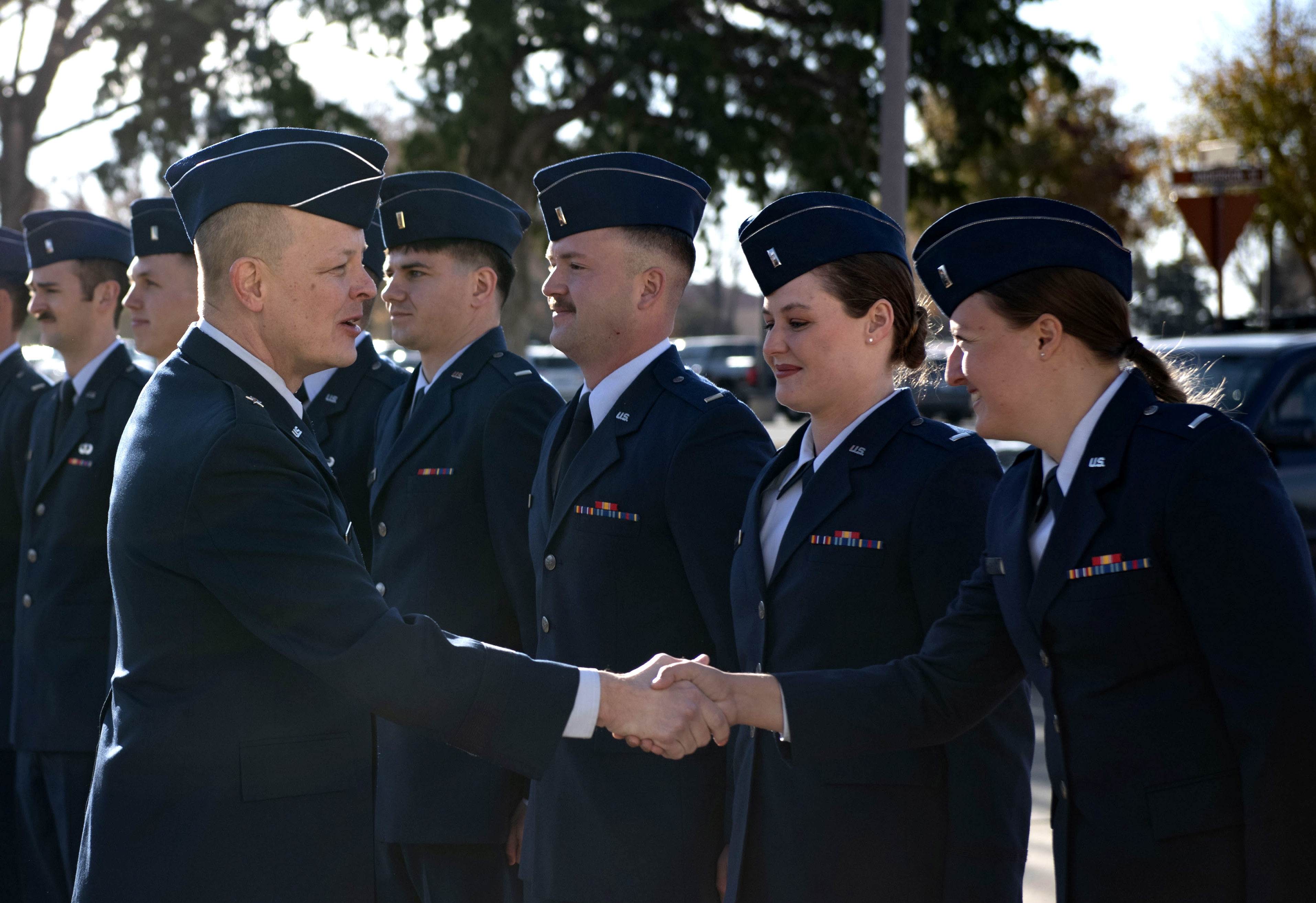 Class 25-03 students pin on wings following their graduation ceremony ...