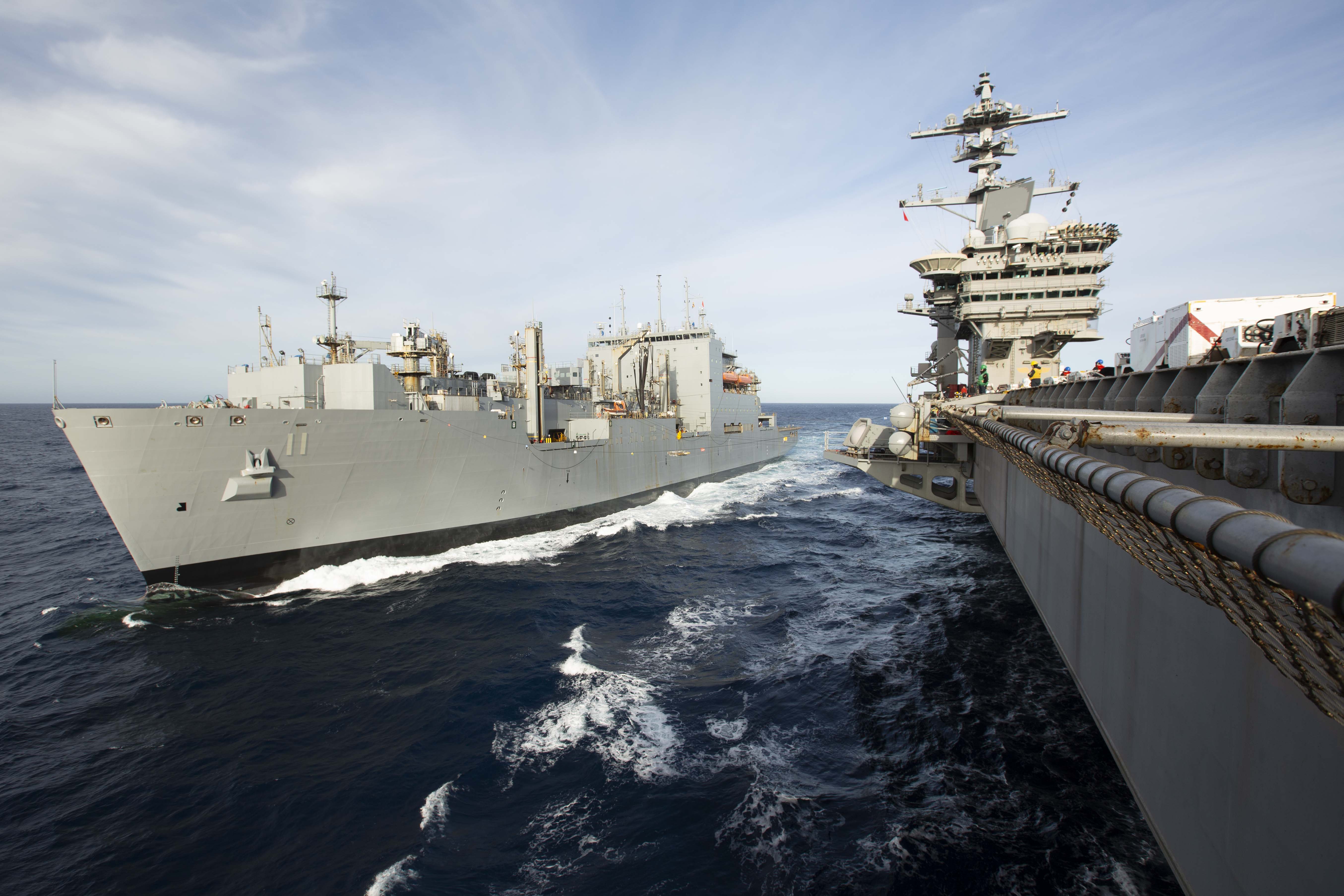 USS Abraham Lincoln conducts ammunition transfer with USNS Washington ...
