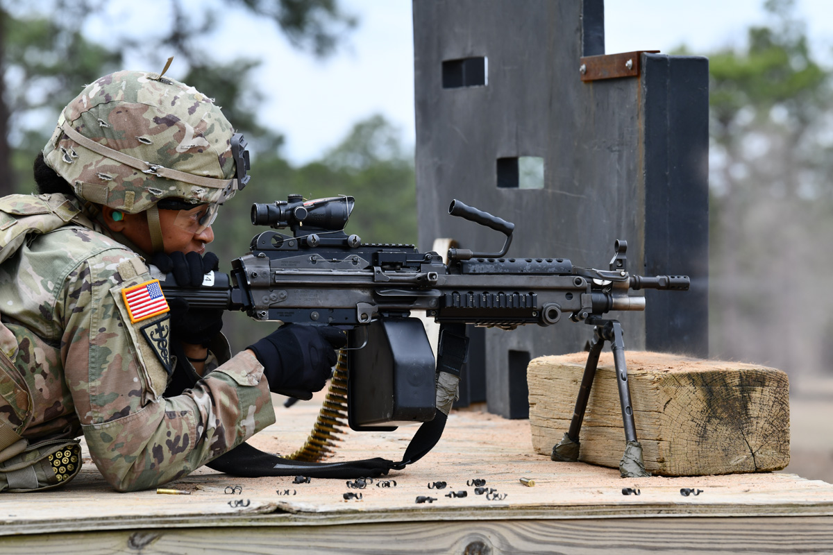 Combat medics use M249 light machine gun during field observational ...