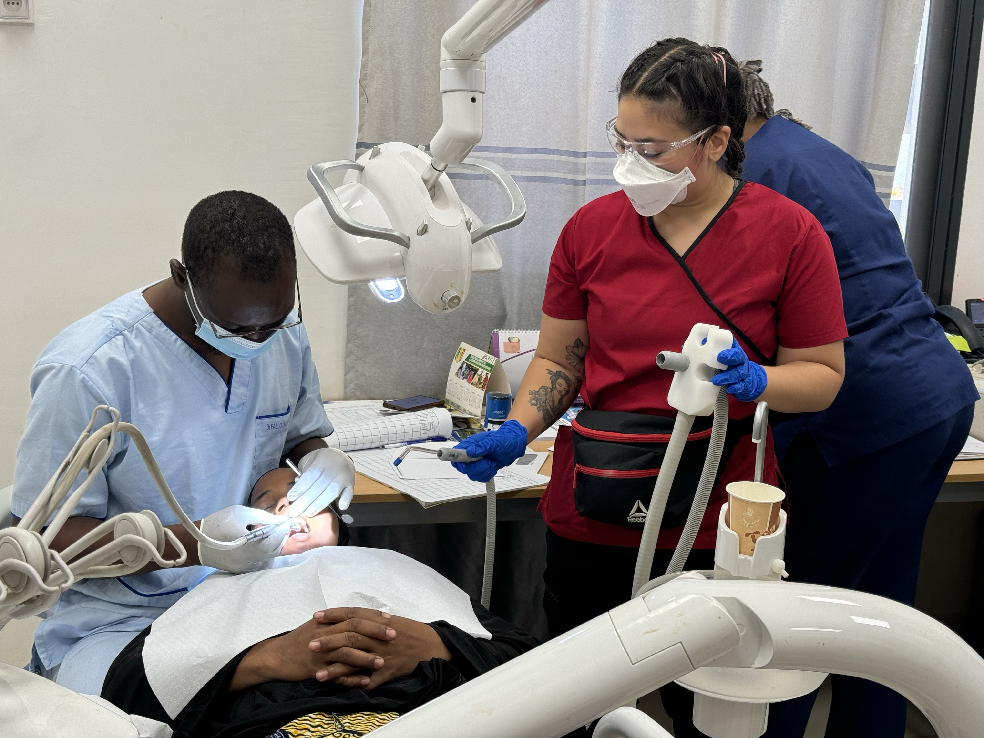 U.S. Air Force Staff Sgt. Devon Bouffard assists a local doctor in ...