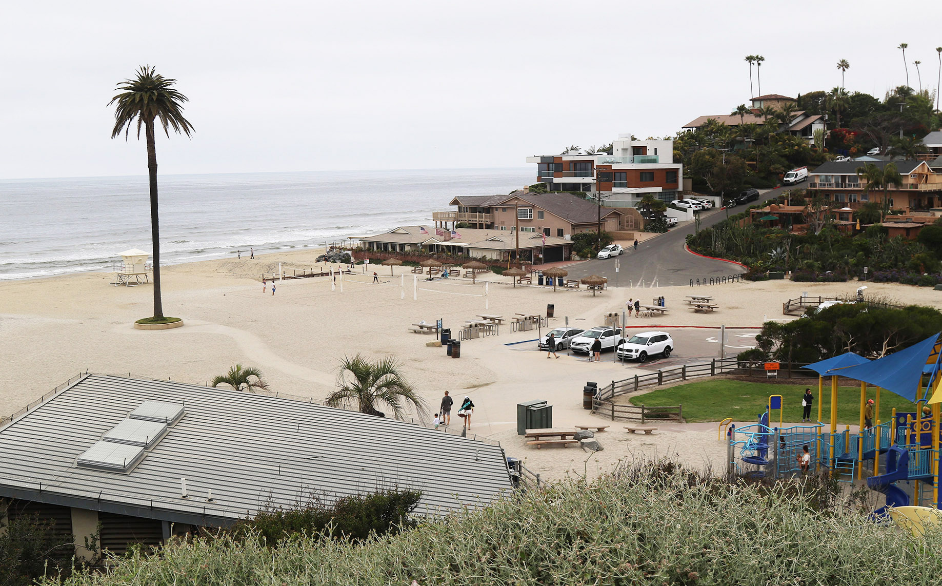 Community, leaders celebrate sand on beach just in time for summer ...