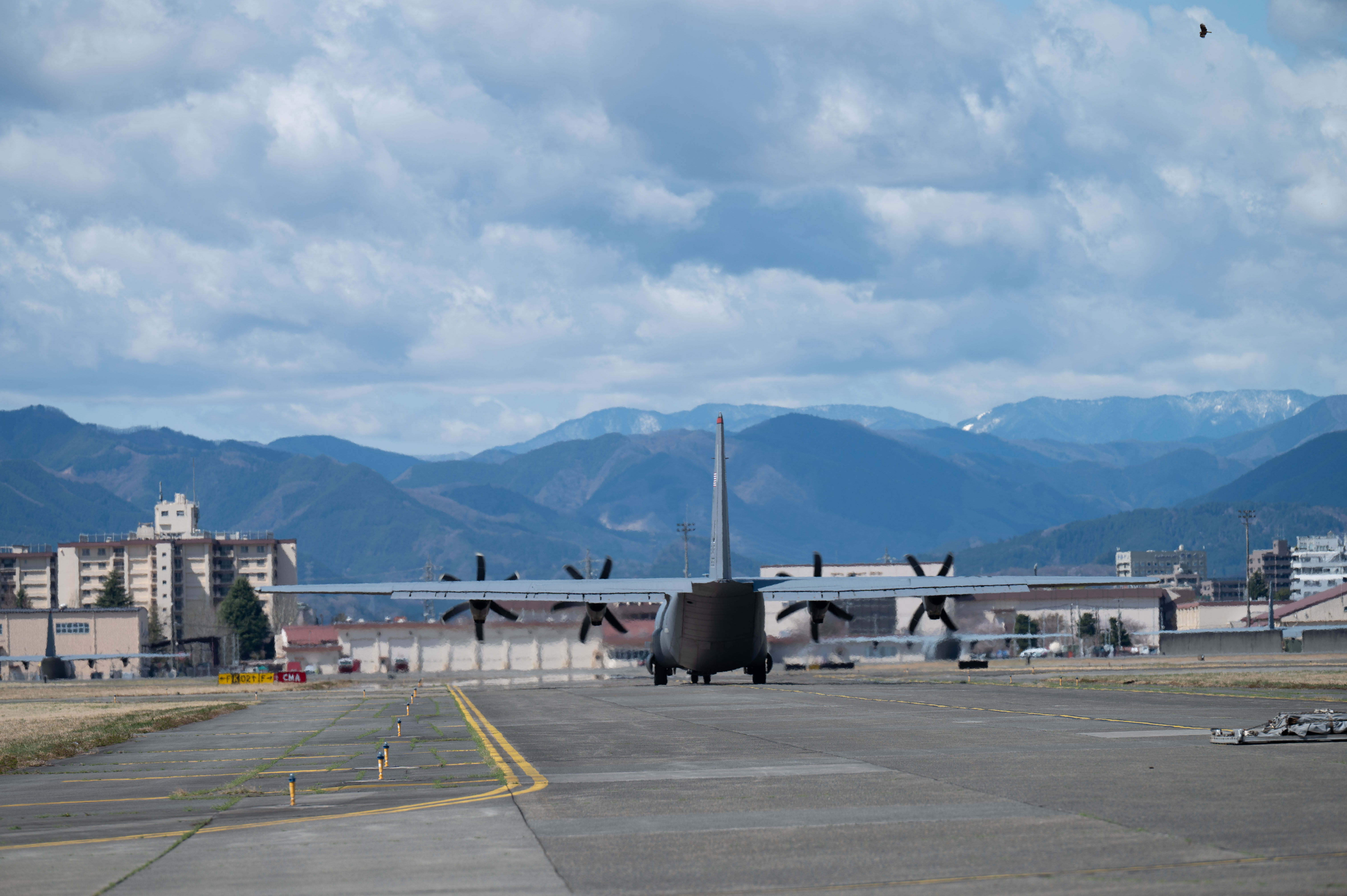 Airmen from the 36 AS, 374 LRS, and 730 AMS conduct engine-running and ...