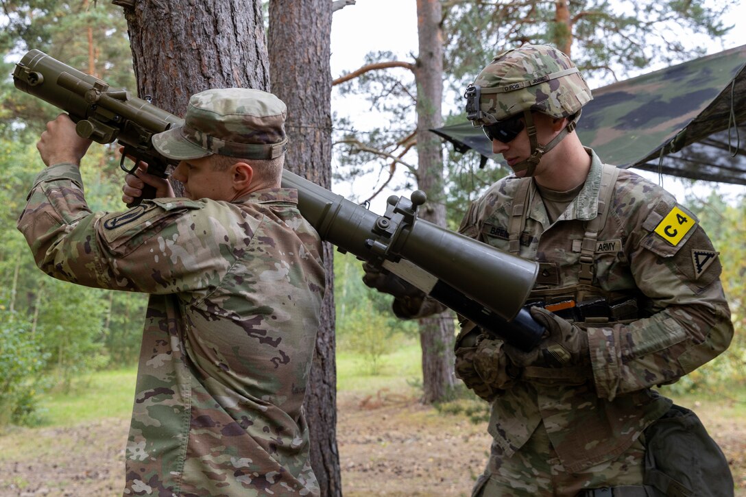 Loading a training Carl Gustaf rocket launcher